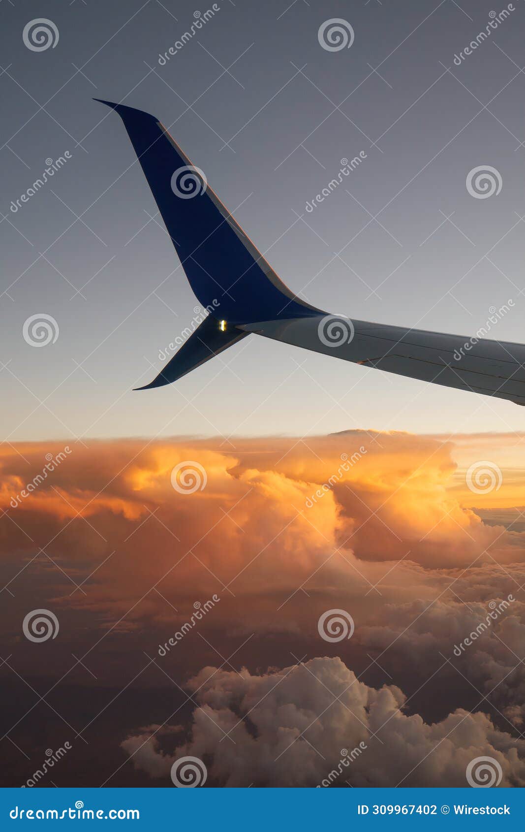 Airplane Flying at Sunset with Clouds in the Sky Stock Photo - Image of ...