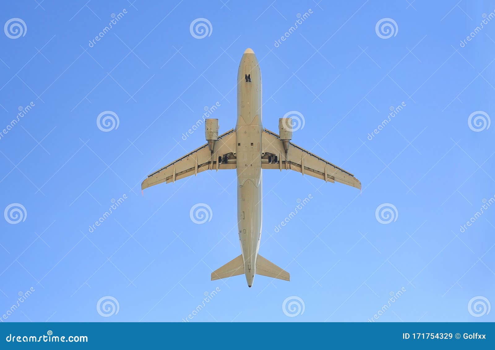 Airplane Flying Under Blue Sky. Seen from Below Stock Image - Image of ...