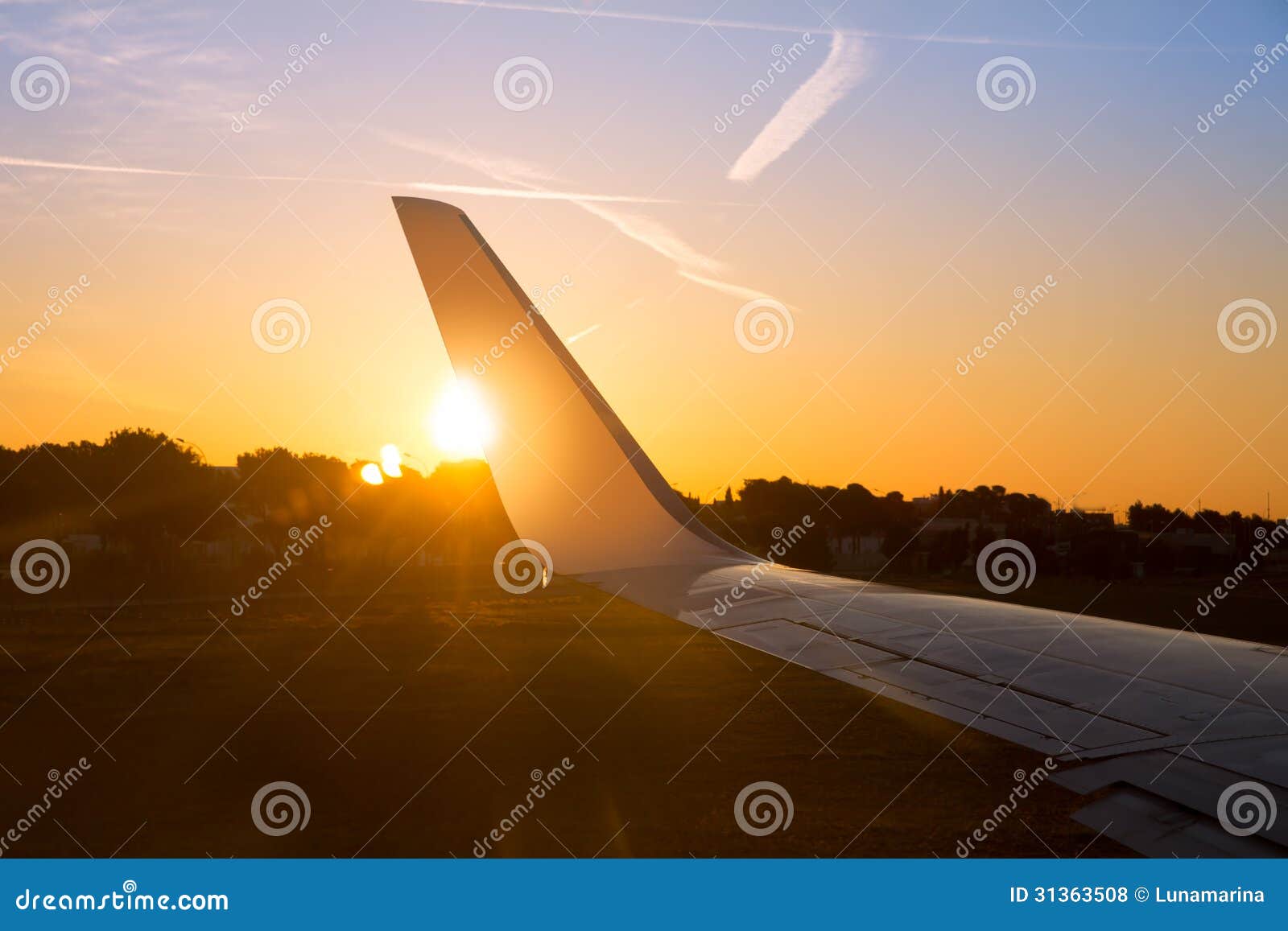 Airplane Jet Wing at Sunset with Golden Sunlight Stock Photo - Image of ...