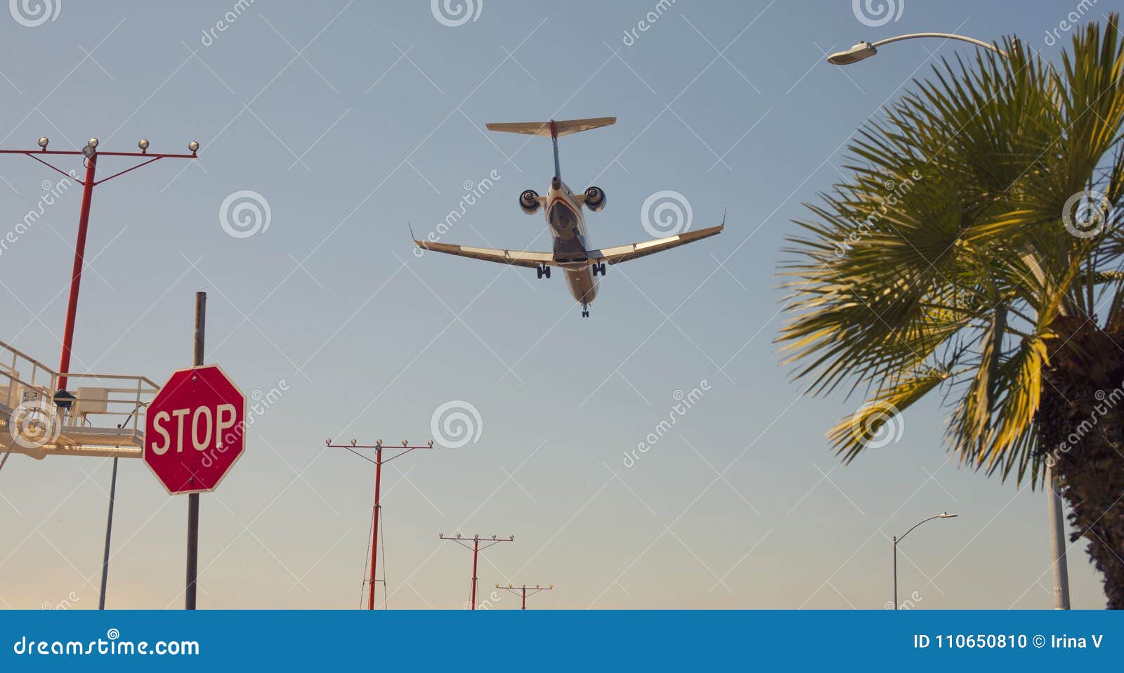 Airplane landing in LAX stock photo. Image of pillar - 110650810