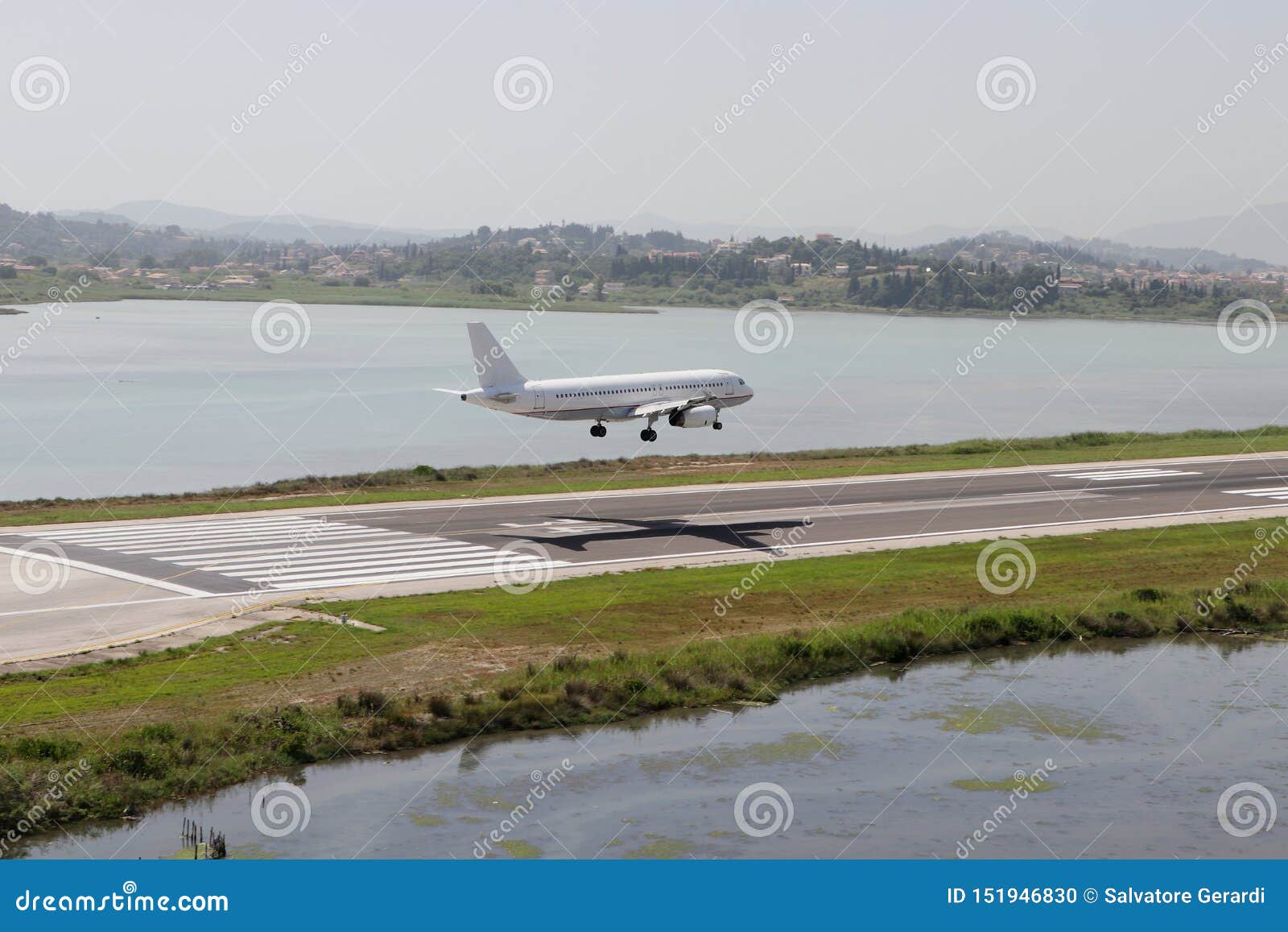Airplane Landing on a Runway Stock Photo - Image of airport, business ...