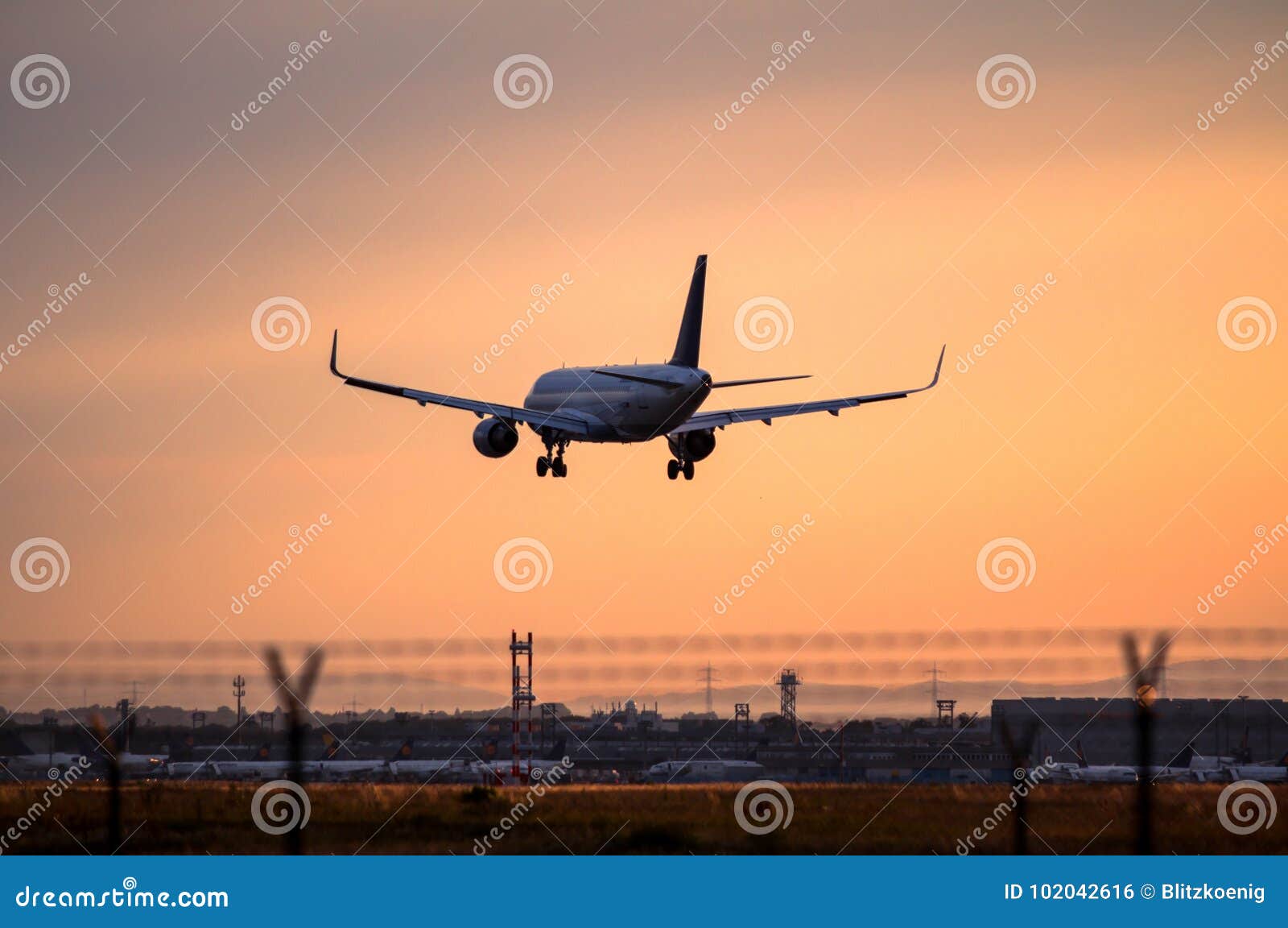 Airplane landing at sunset editorial photo. Image of taking - 102042616