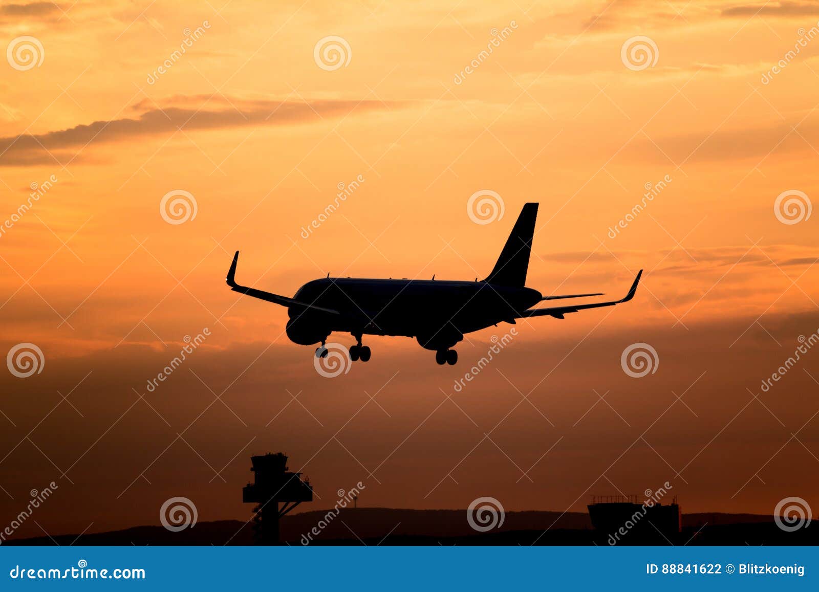 Airplane landing at sunset stock photo. Image of airplane - 88841622