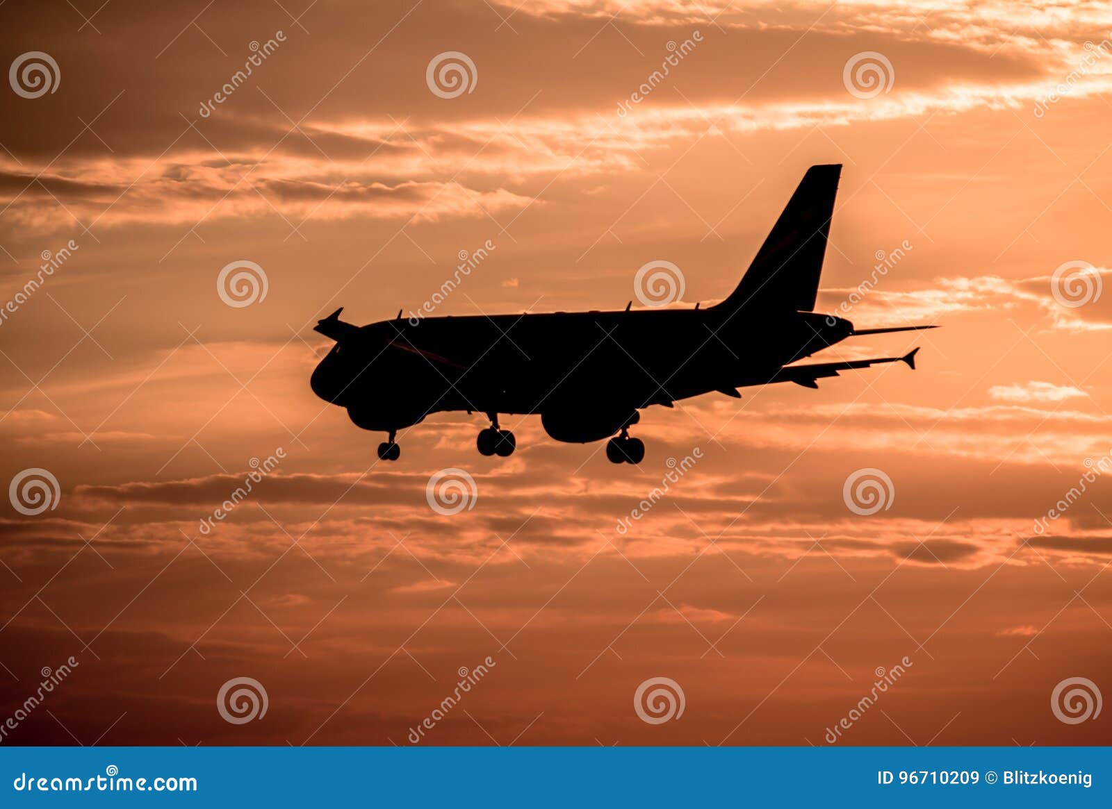 Airplane landing at sunset stock image. Image of sunset - 96710209