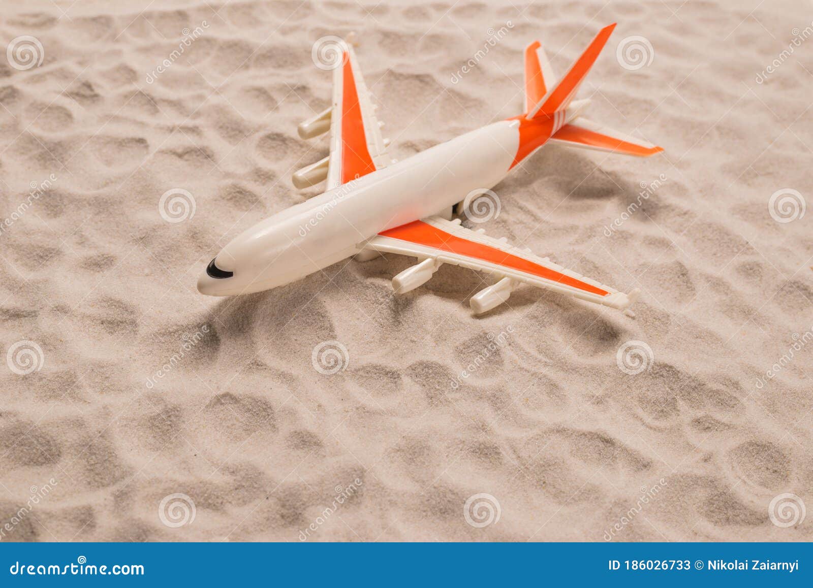 Airplane lay on sand stock image. Image of creative - 186026733
