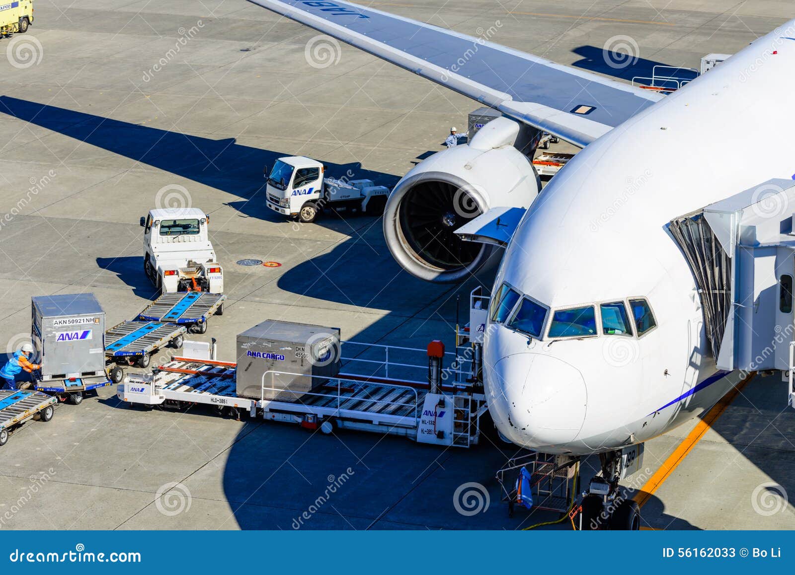 An ANA Airplane Loading Off Its Passengers And Cargo At Narita ...