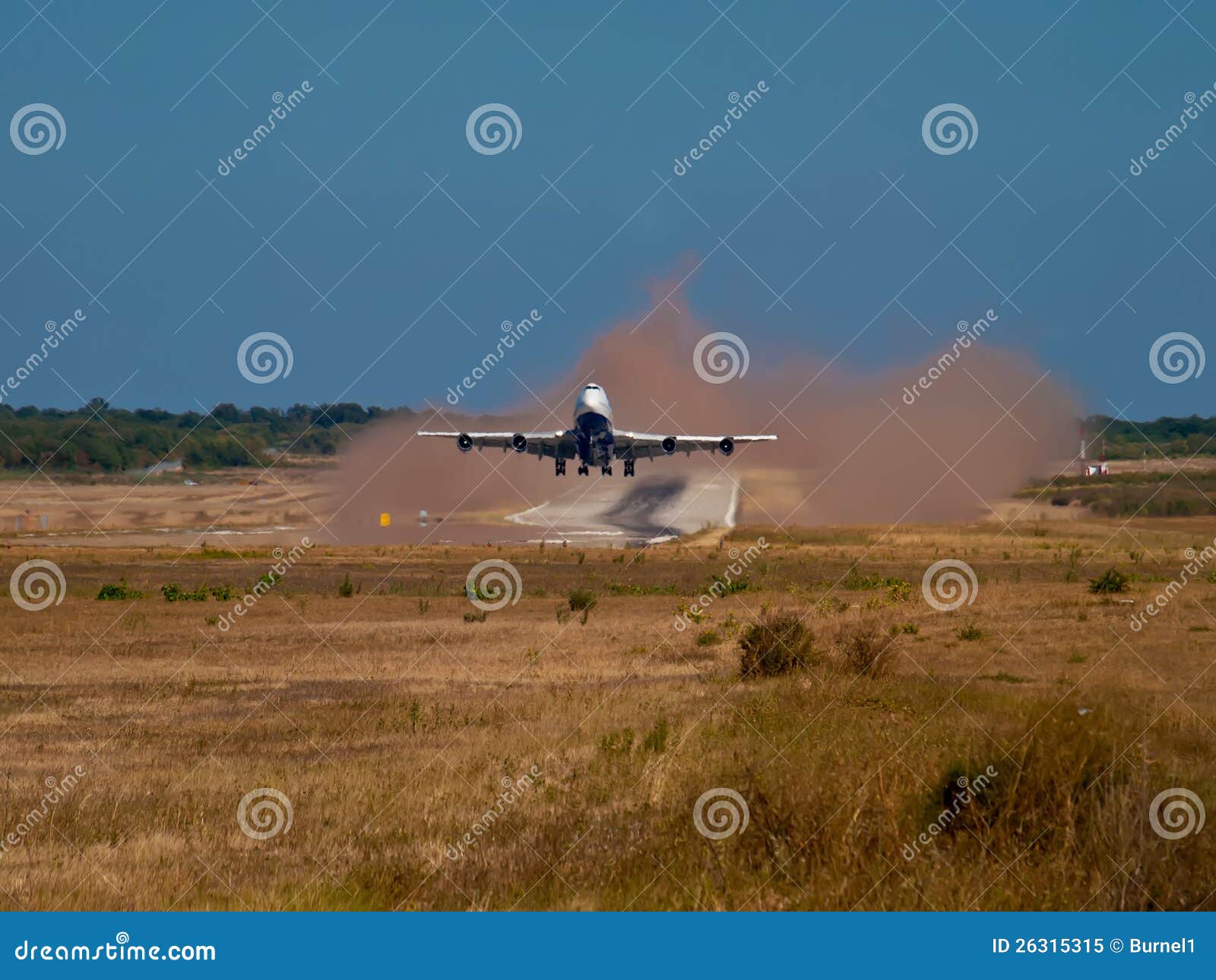 Airplane make some dust stock image. Image of airport - 26315315