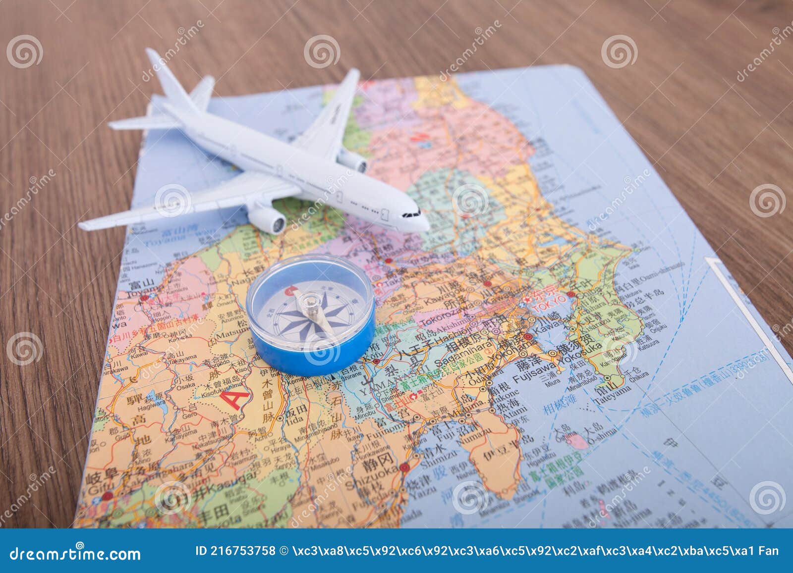 An Airplane Model and a Compass on a Paper Japan Travel Map Stock Photo ...