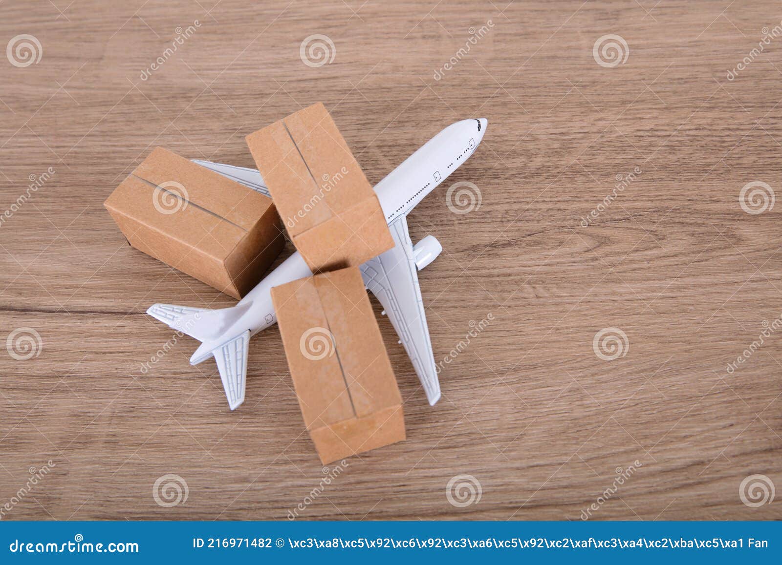 An Airplane Model and a Courier Shipping Box Model on the Table Stock ...