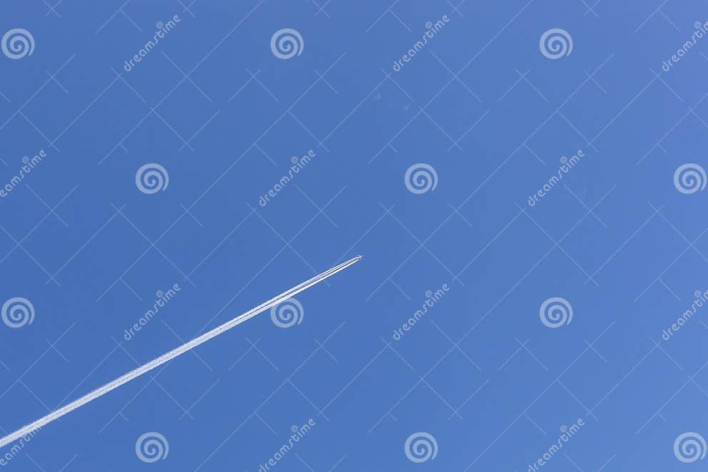 An Airplane Moving Over the Blue Sky Background Stock Photo - Image of ...