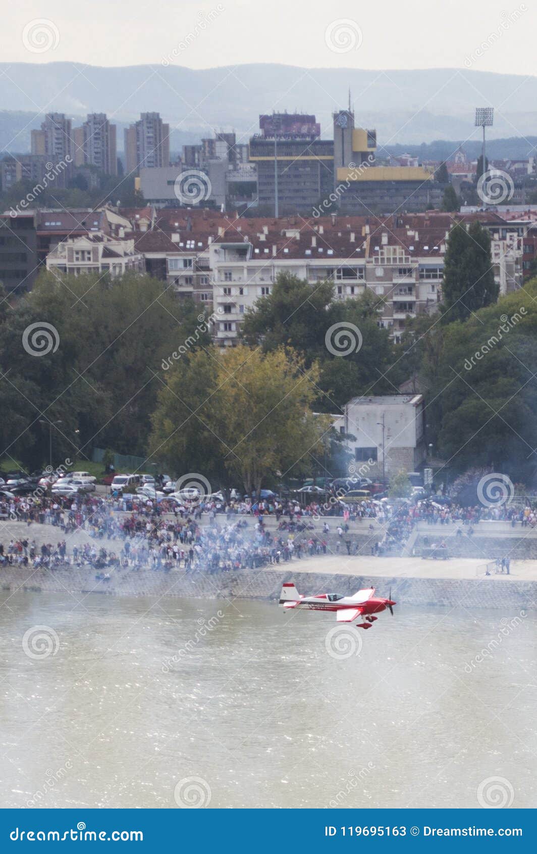 Airplane over crowds stock image. Image of people, river - 119695163