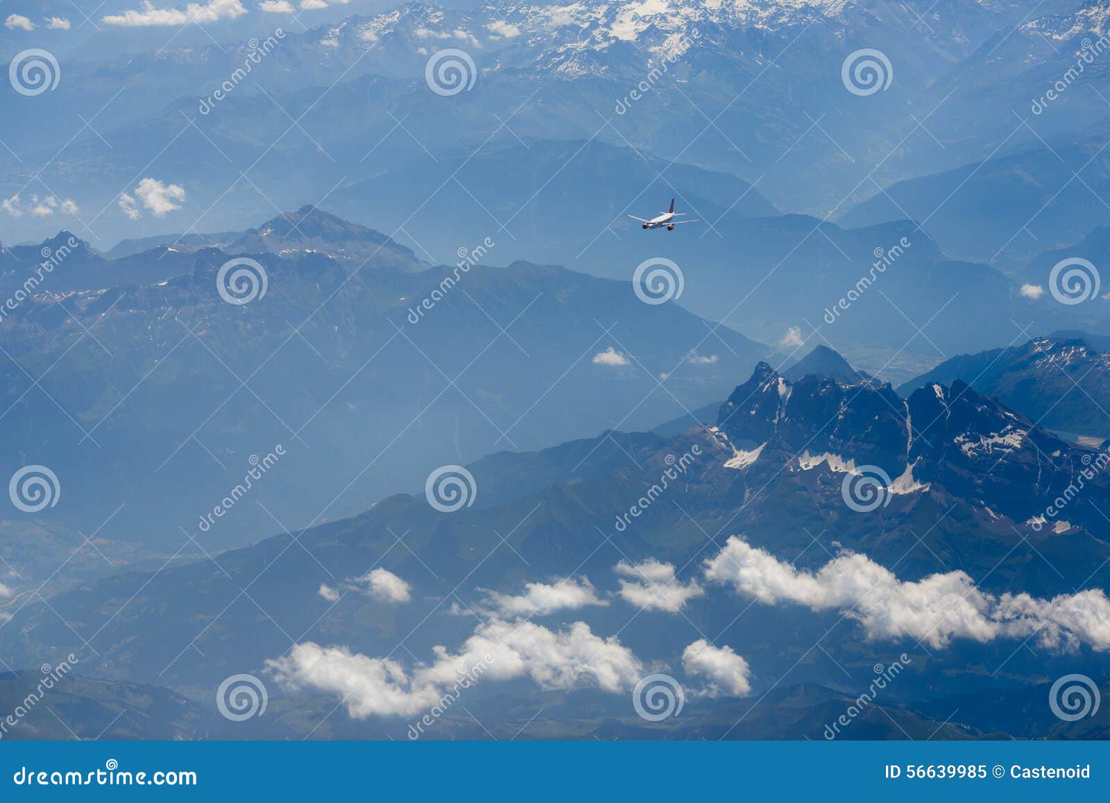 Airplane over the mountain stock image. Image of blue - 56639985