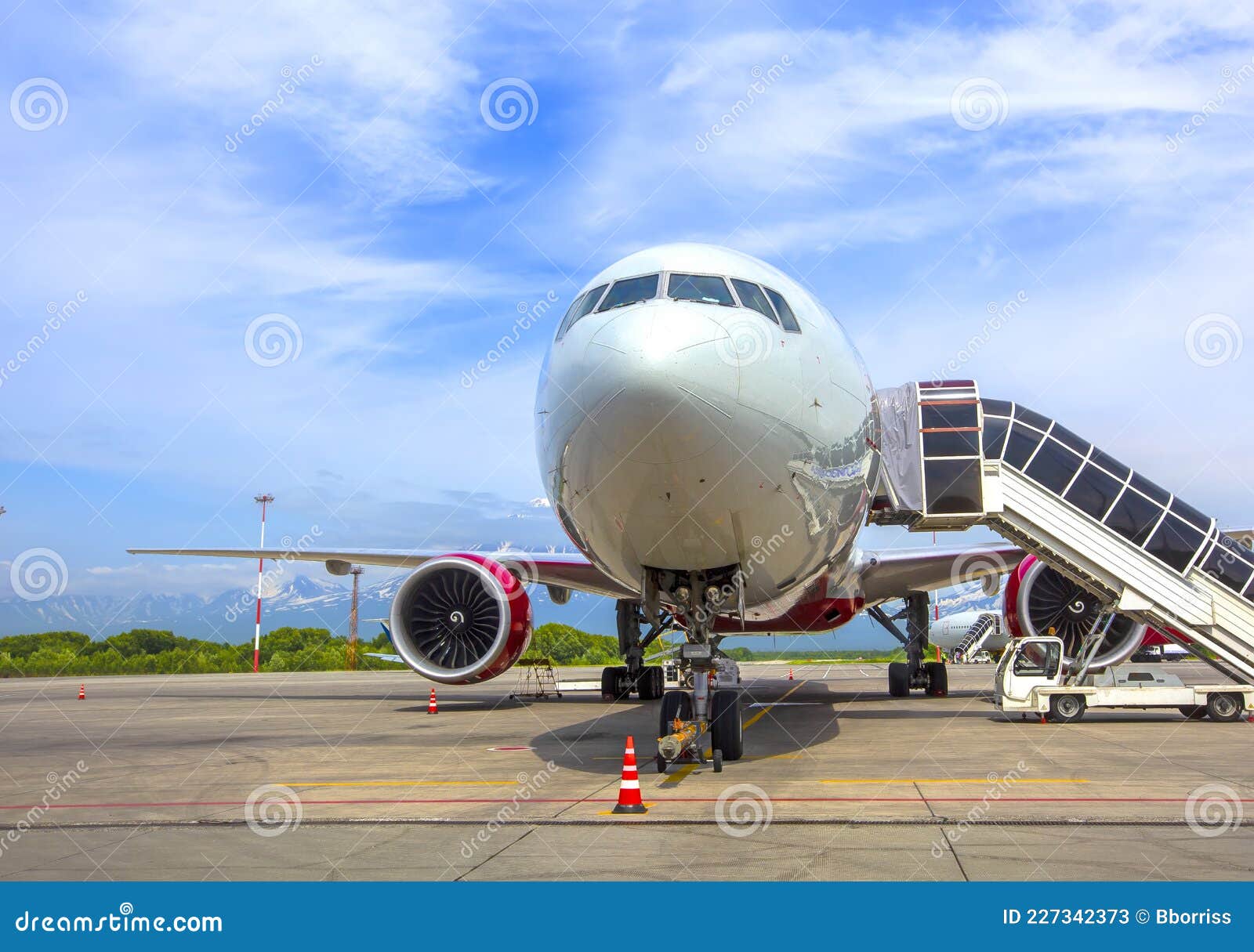 Airplane with a Passenger Boarding Steps on the Airport Apron Editorial ...