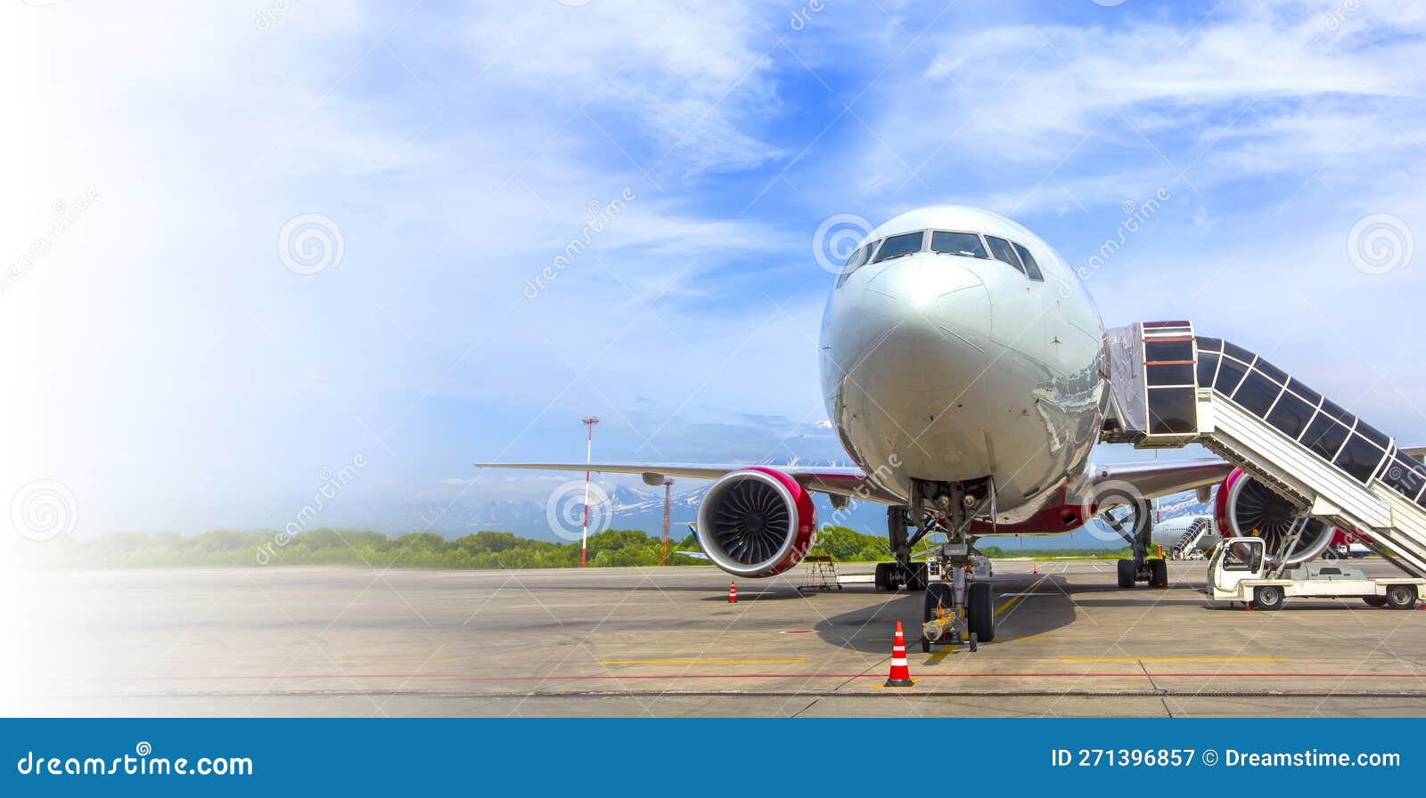 Airplane with a Passenger Boarding Steps on the Airport Apron Stock ...