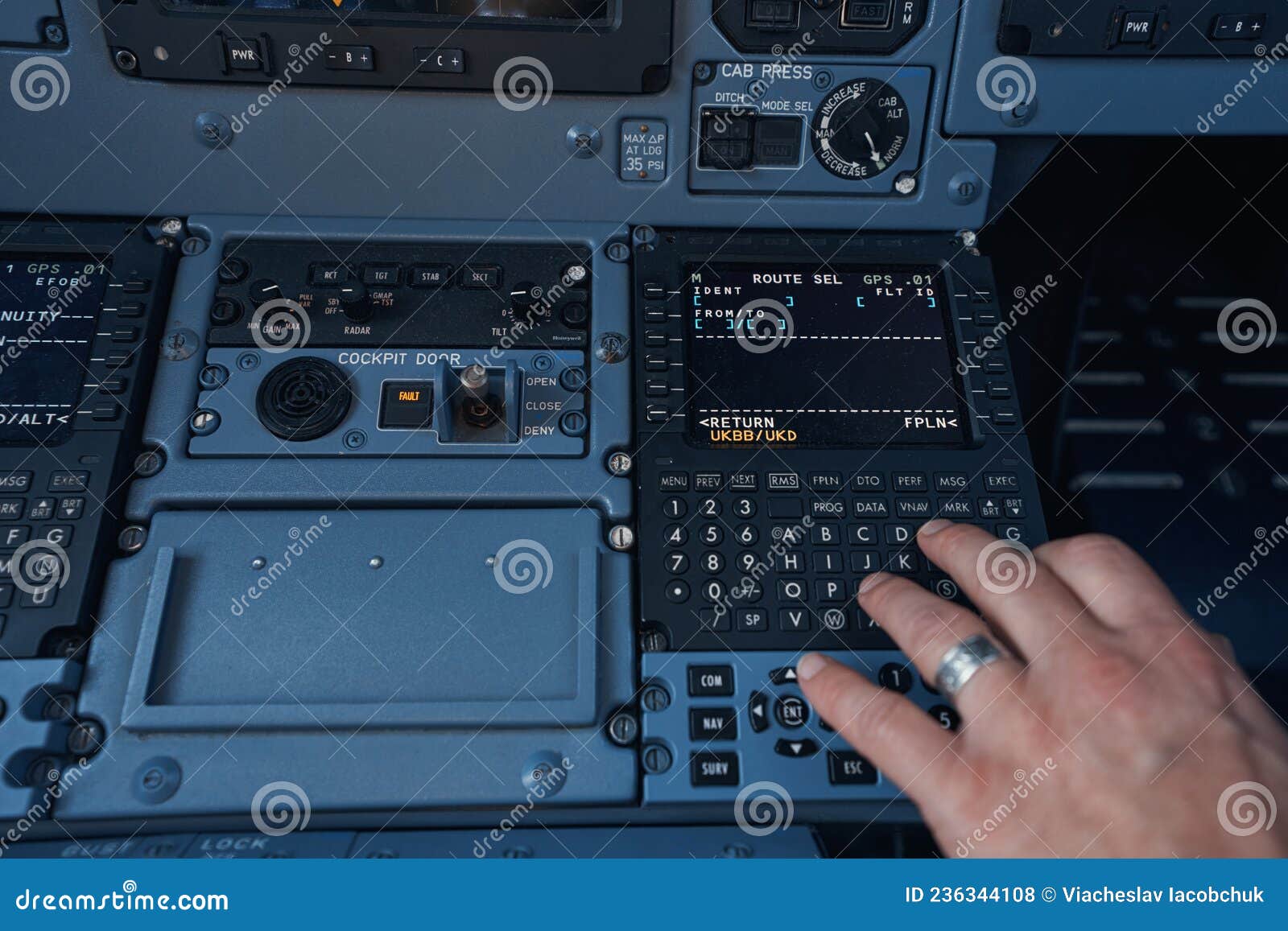 Pilot Inserting Flight Information into Plane System Stock Photo ...
