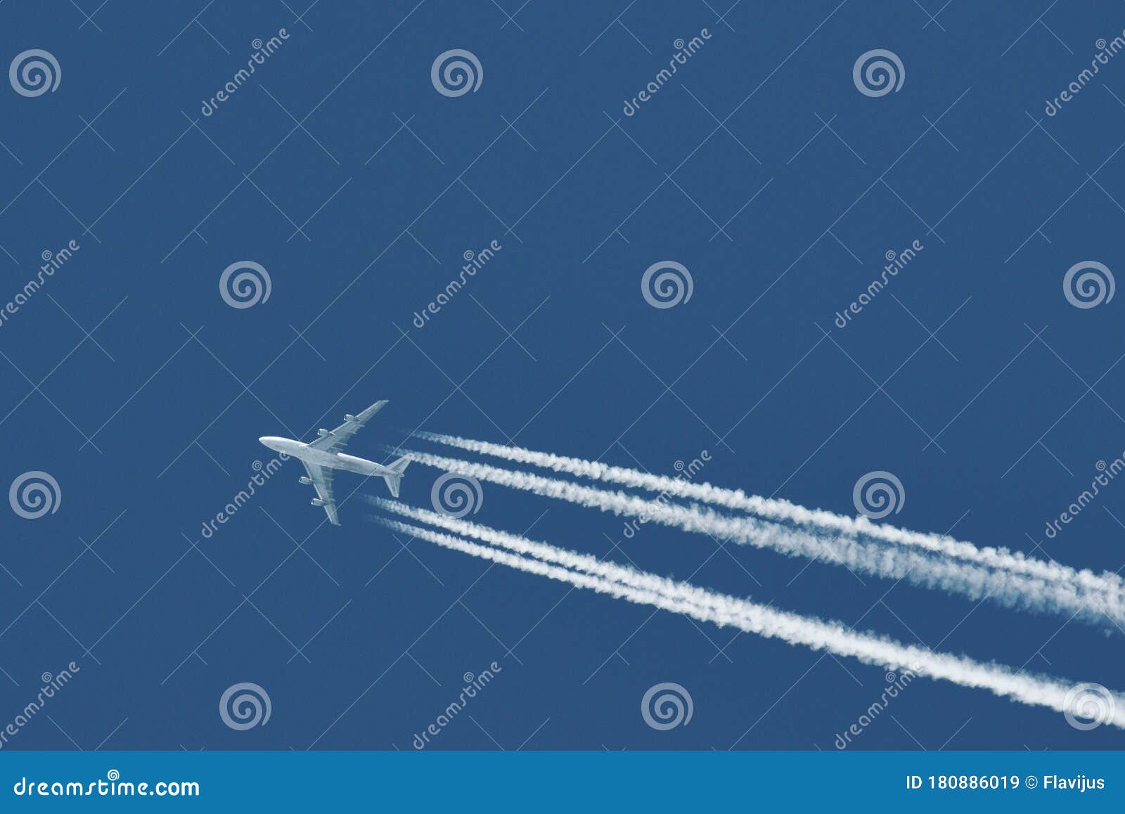 Airplane with Plane Trails stock image. Image of clear - 180886019