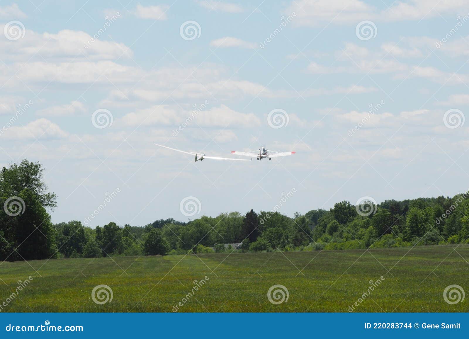 The Airplane is Pulling the Glider Higher in the Sky. Stock Photo ...