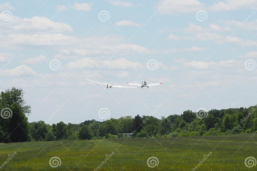 The Airplane is Pulling the Glider Higher in the Sky. Stock Photo ...