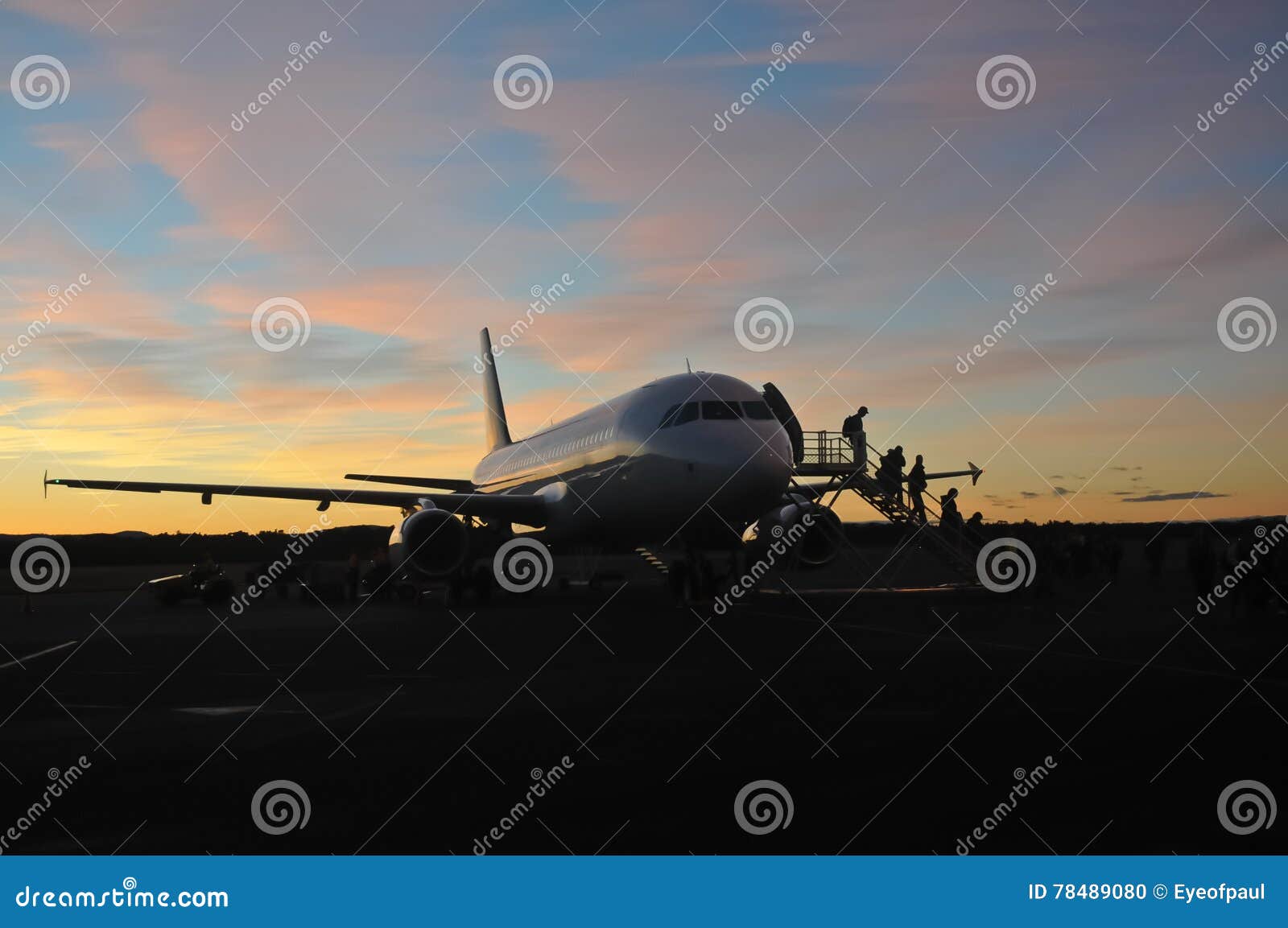 Airplane Scene and Passengers Exit at the Early Morning Stock Photo ...