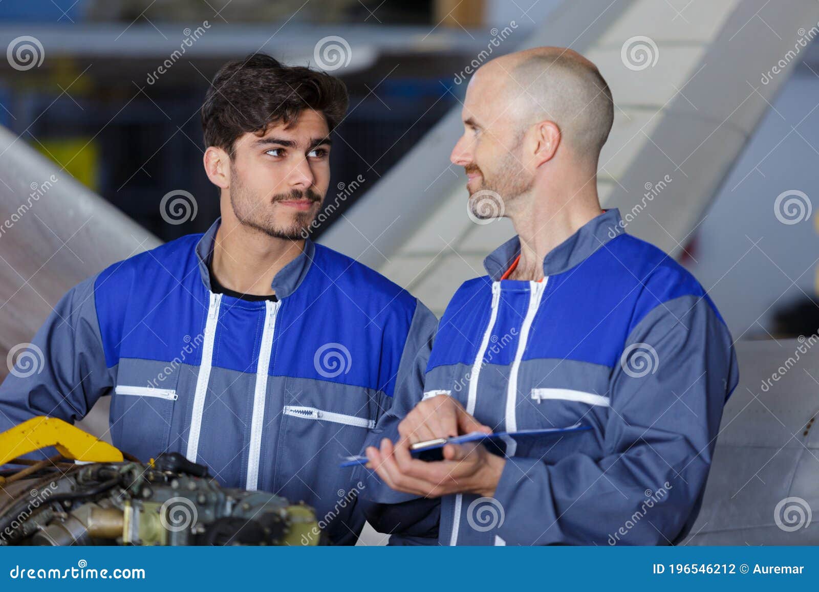 Airplane Service Crew Repairing Plane in Hangar Stock Photo - Image of ...