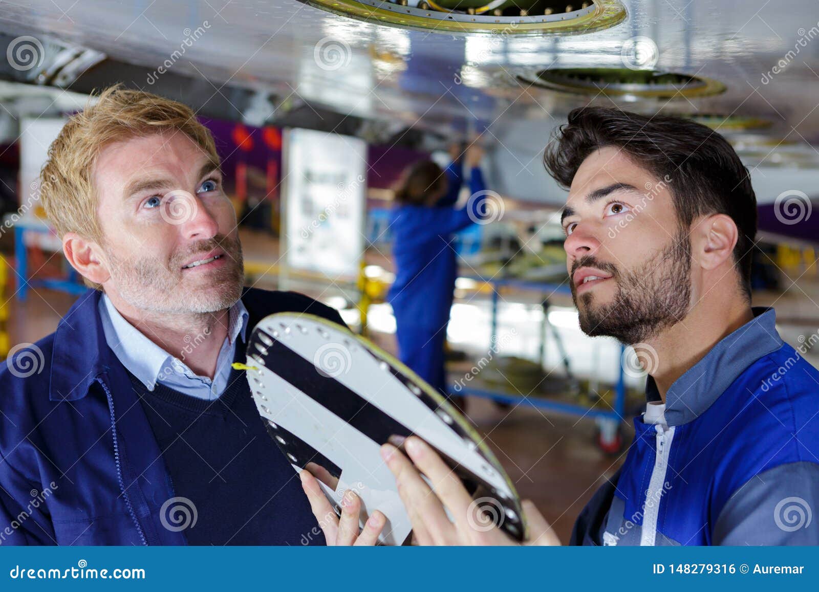 Airplane Service Team Repairing Plane in Hangar Stock Photo - Image of ...