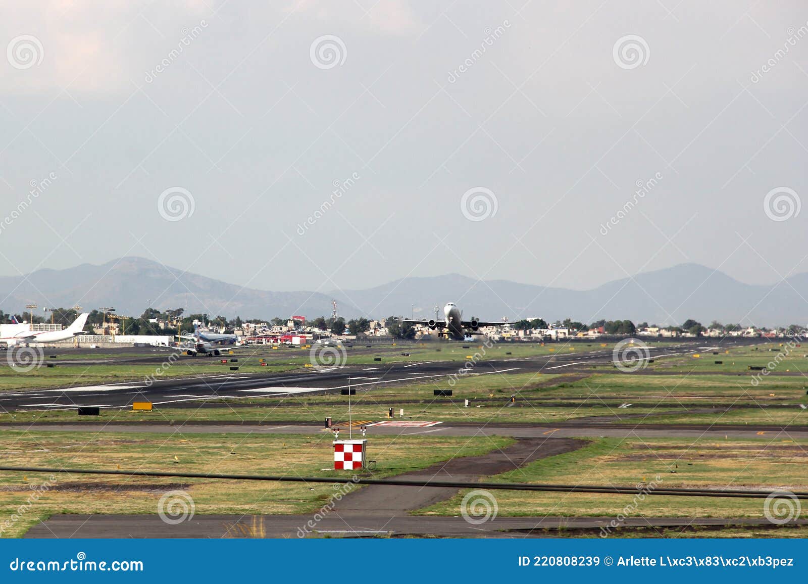 Airplane Settling on Runway To Take Off or Land Stock Image - Image of ...