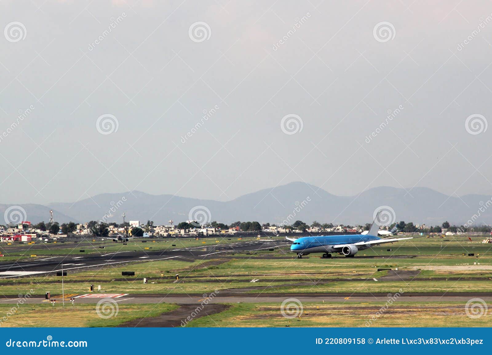 Airplane Settling on Runway To Take Off or Land Stock Photo - Image of ...