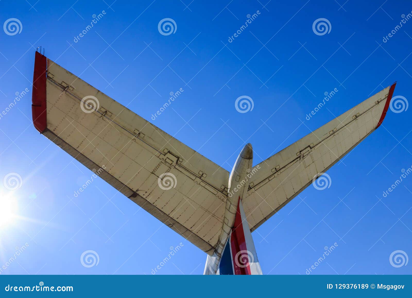 Airplane Tail on Blue Sky Background Stock Image - Image of assembly ...