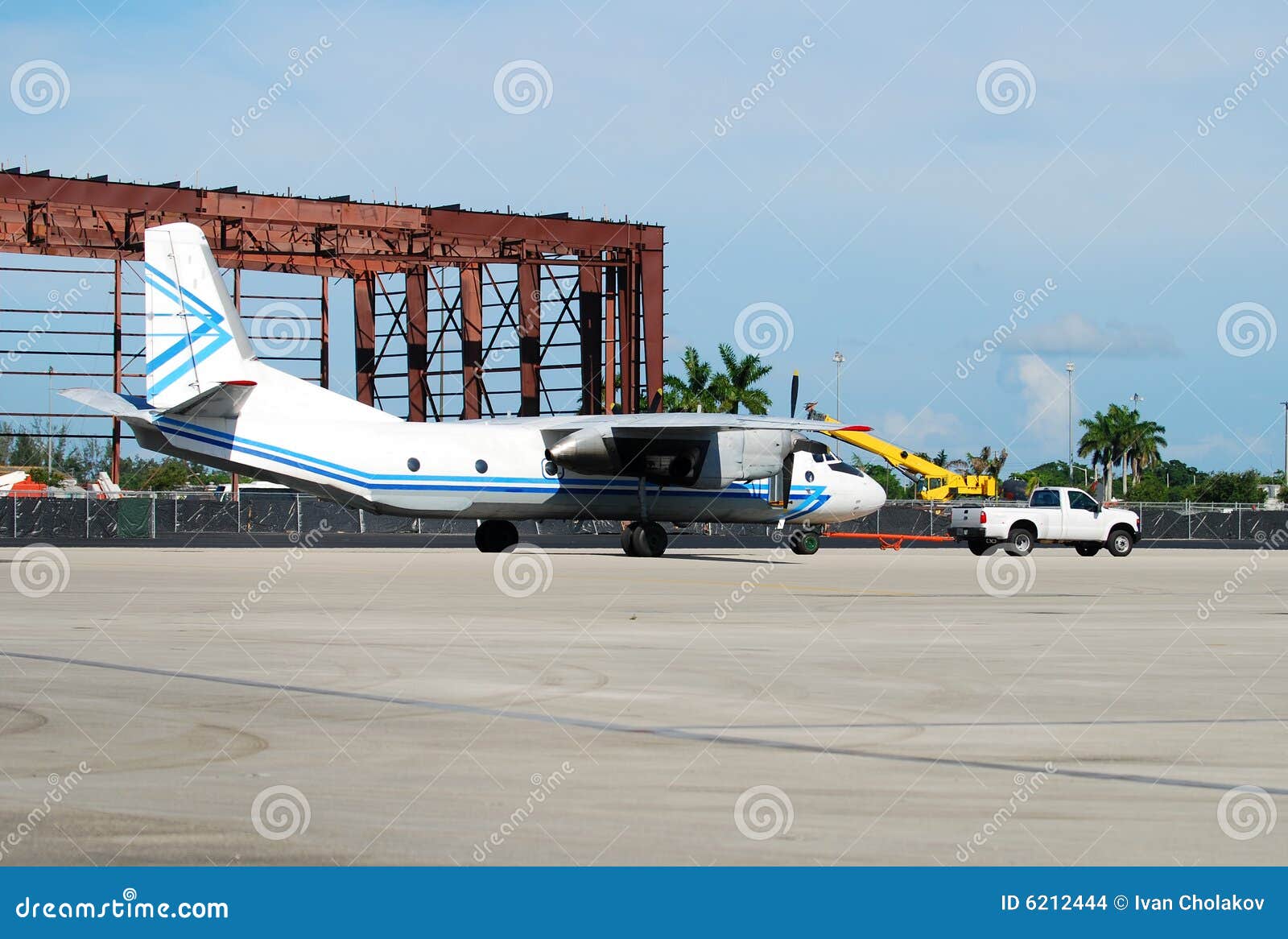 Airplane Towing Glider On A Day With Clear Skies And Green Vegeteation ...