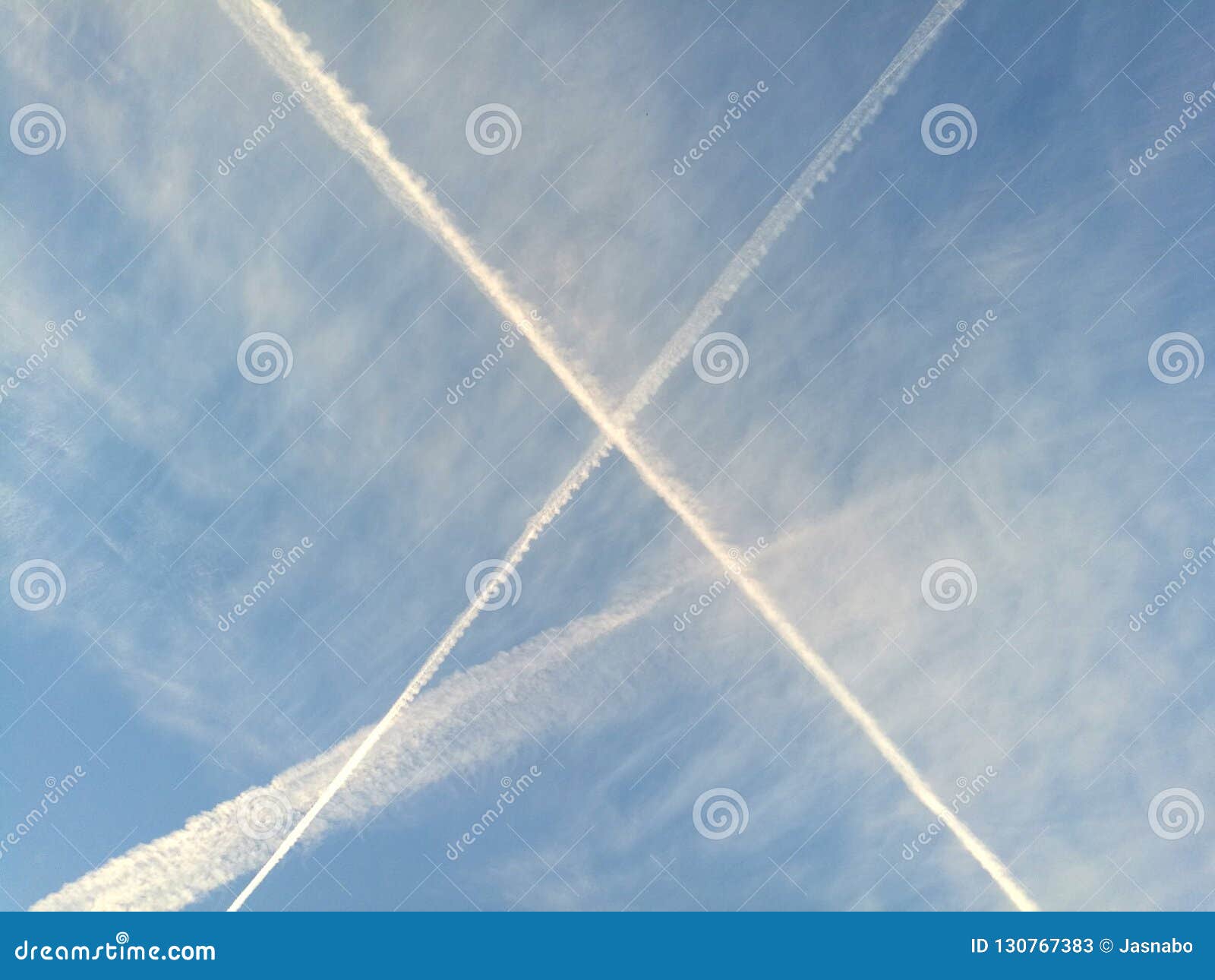 Airplane trails stock image. Image of crossing, aviation - 130767383
