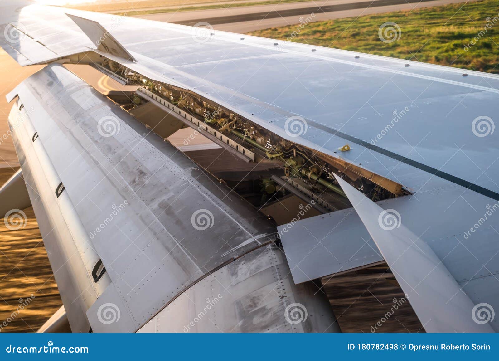 Airplane Window View of Wing and Flaps Stock Photo - Image of runway ...