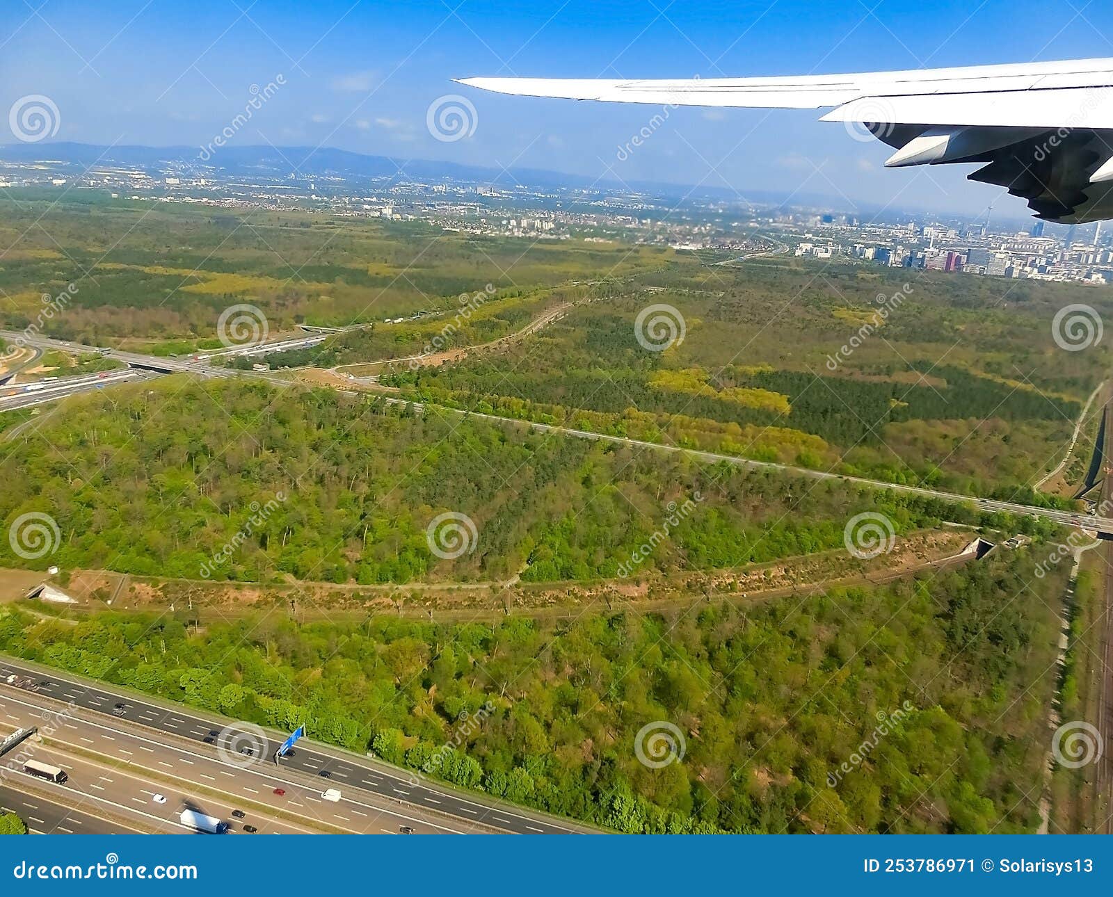 Airplane Window View of Wing, Highway Junctions and Green Forest. Stock ...