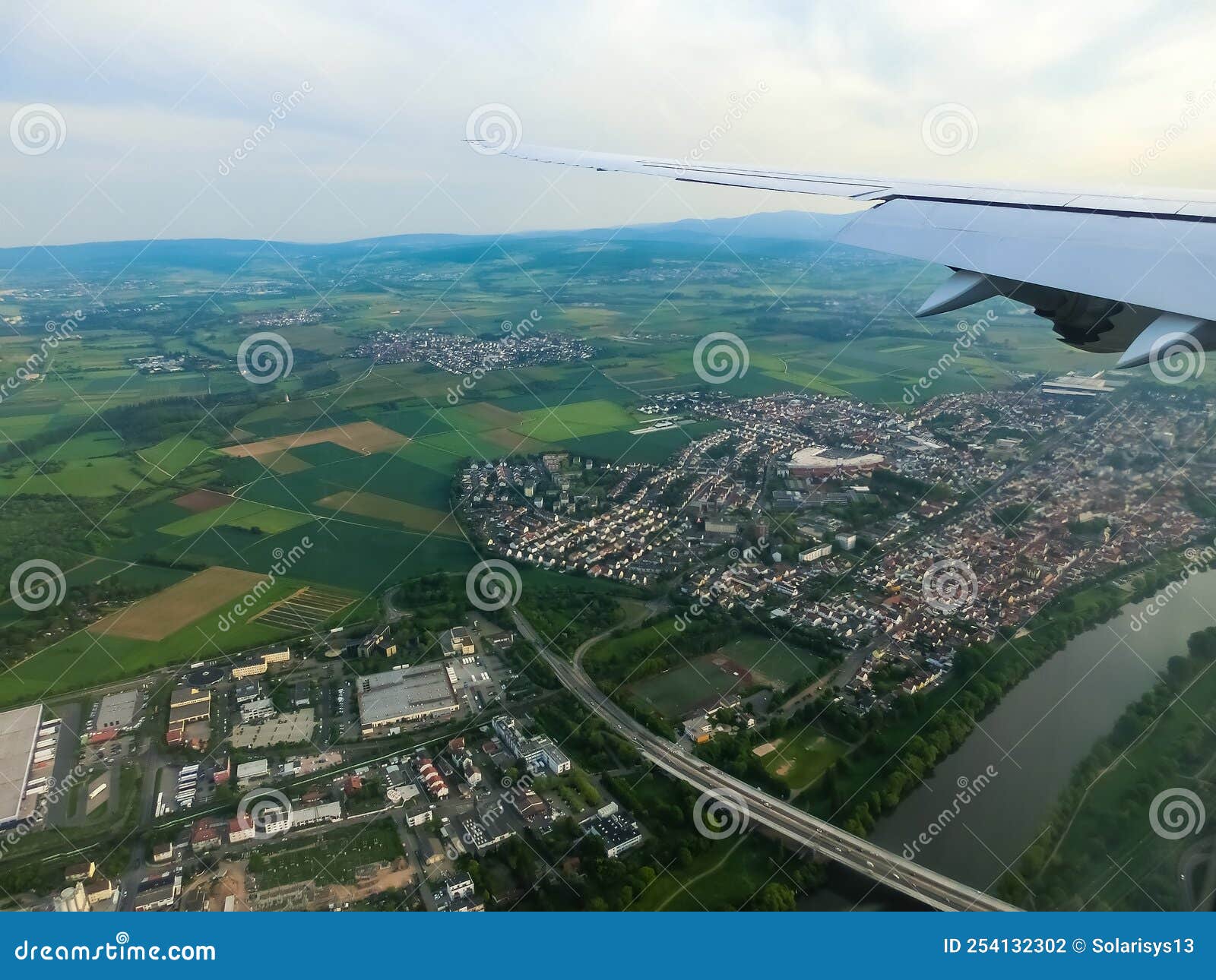 Airplane Window View of Wing, Highway Junctions and Green Forest. Stock ...