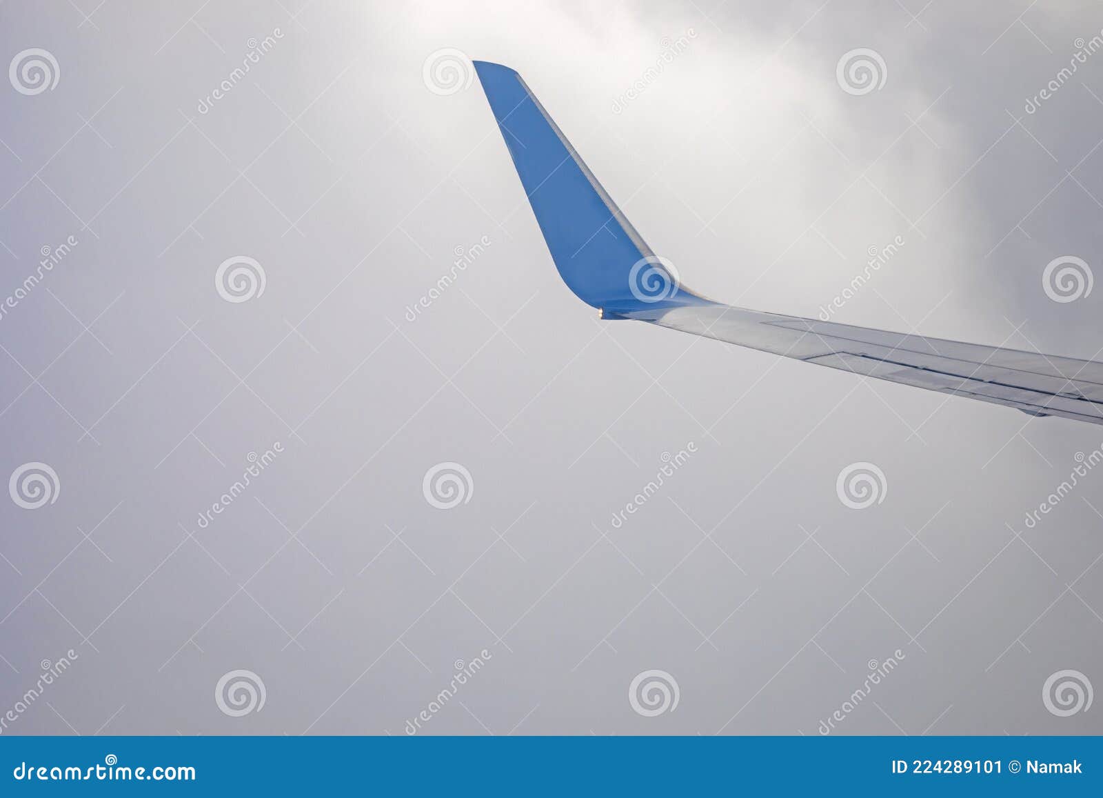 Airplane Wing on a Background of Gray Clouds, Horizontal Stock Image ...