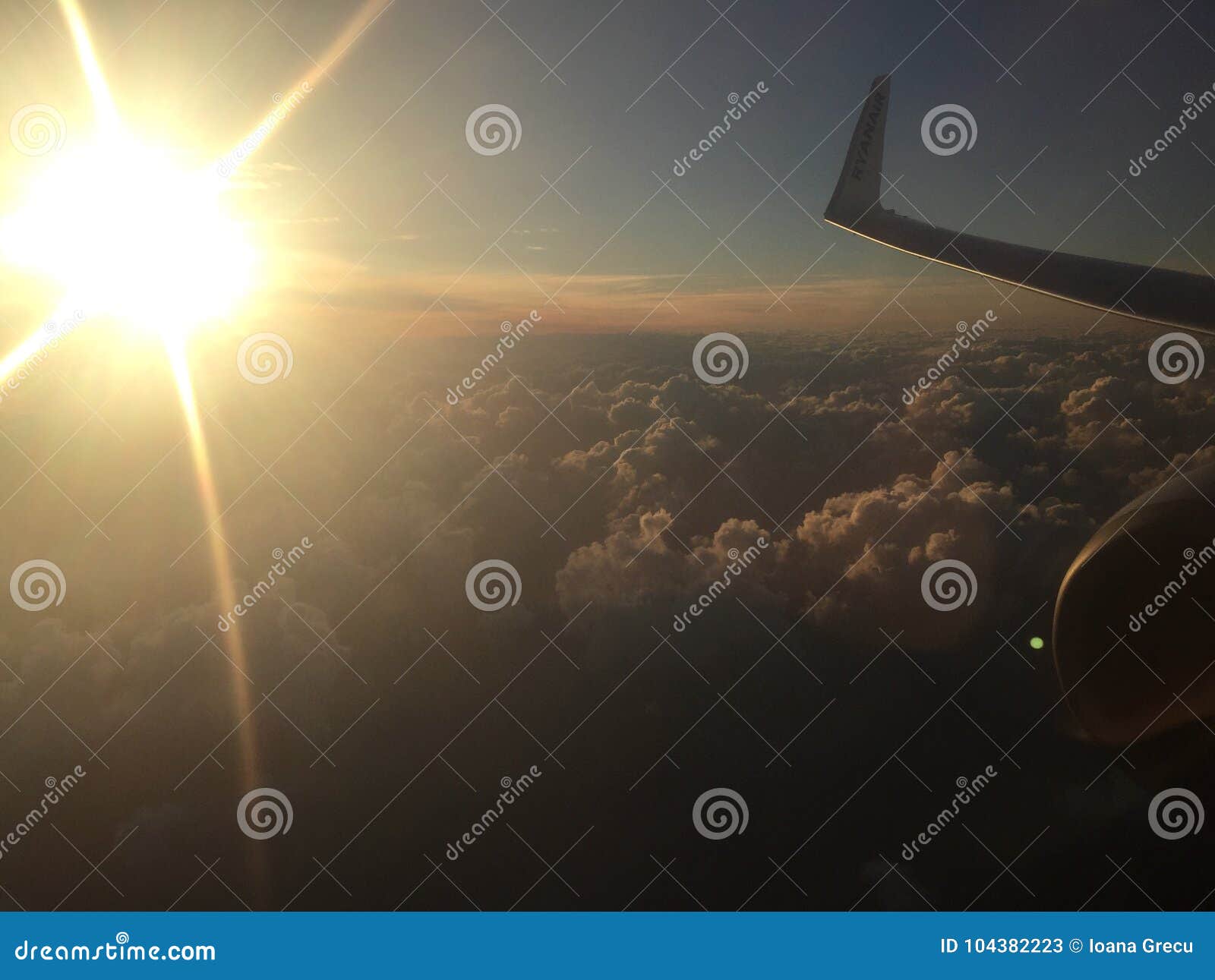 Airplane Wing and Engine with Sun and Clouds Editorial Stock Photo ...