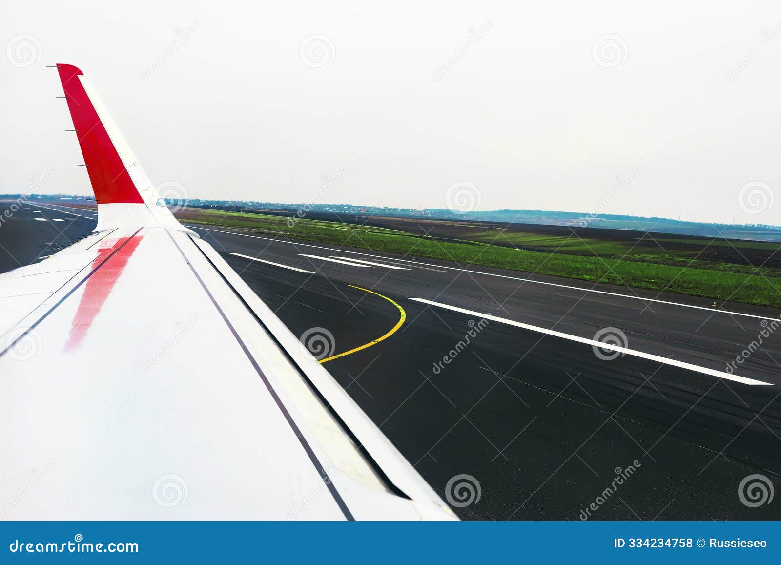Airplane Wing Extends Over the Runway Stock Photo - Image of ailerons ...