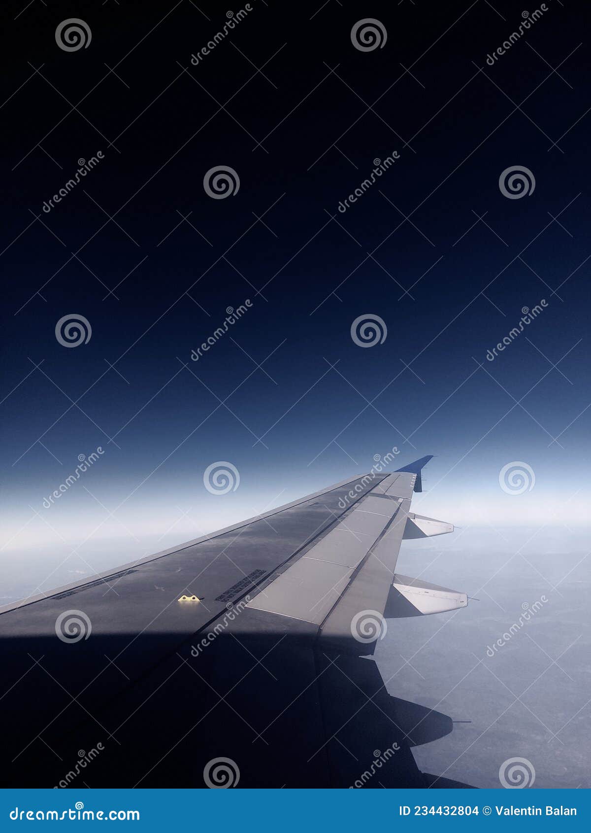 Airplane wing in flight. stock photo. Image of aviation - 234432804