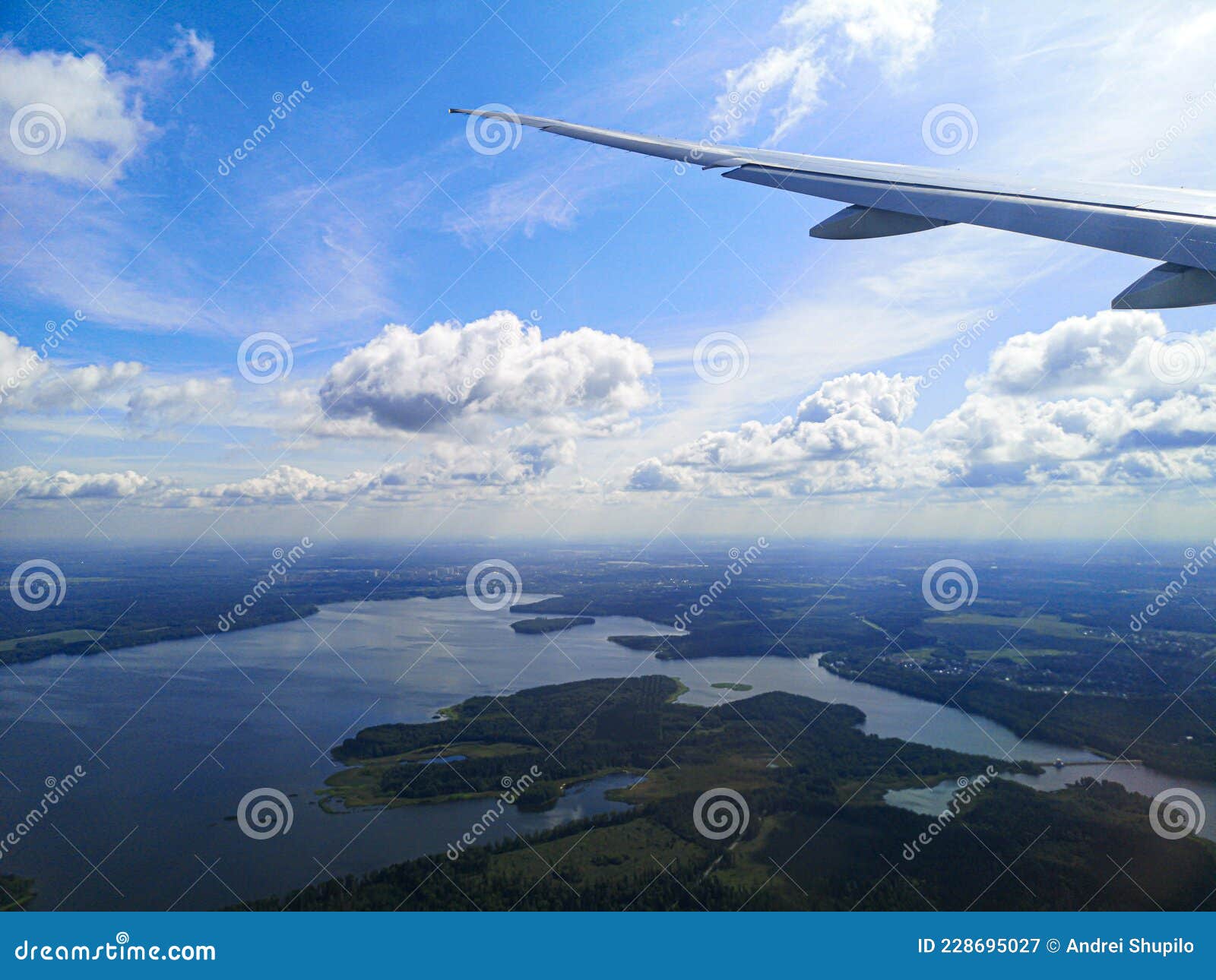 Airplane wing in flight stock image. Image of travel - 228695027