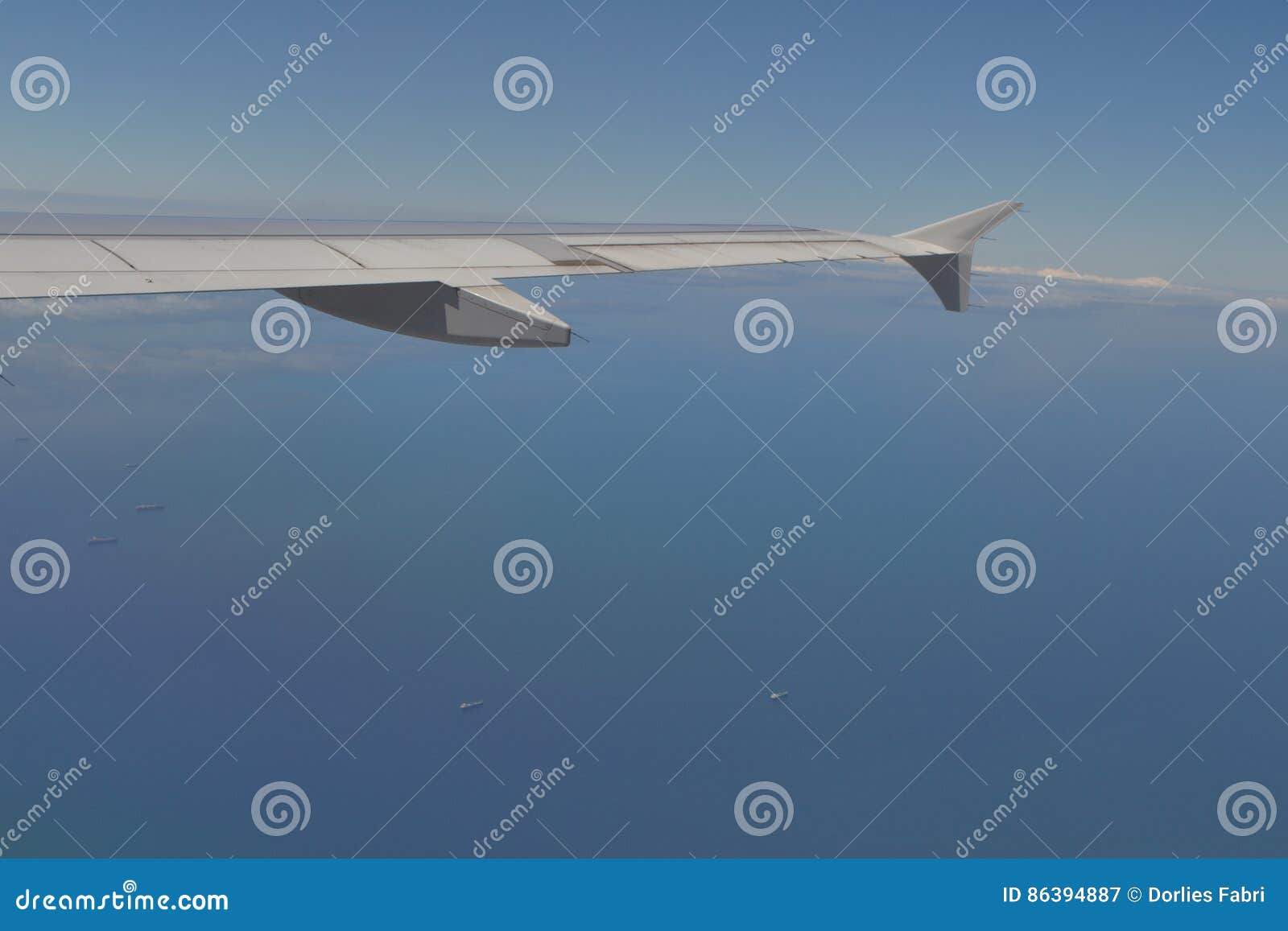 Airplane Wing in Front on Blue Sky. Stock Image - Image of trip, water ...