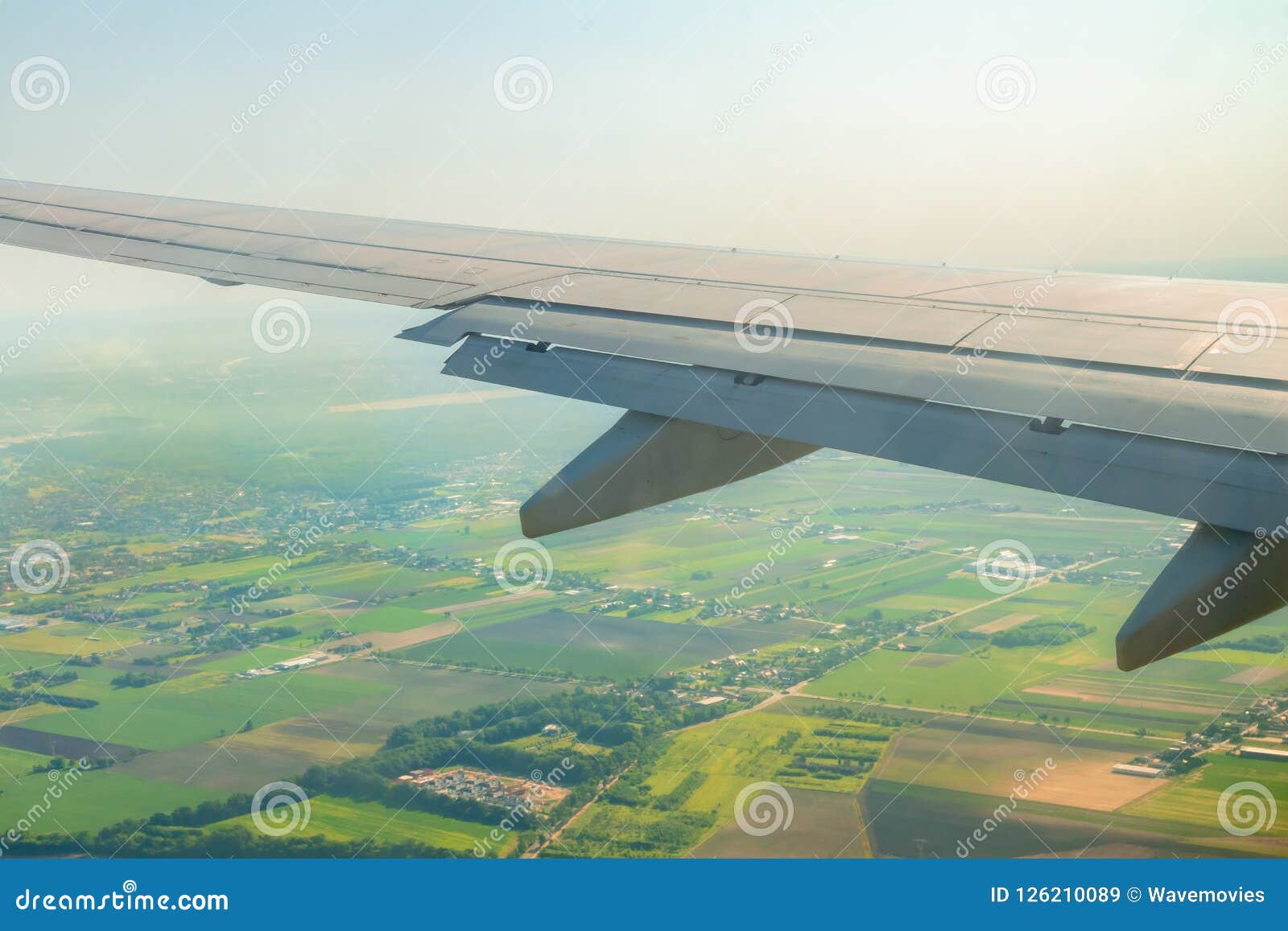 Airplane Wing during Landing with Flaps Down Stock Image - Image of ...