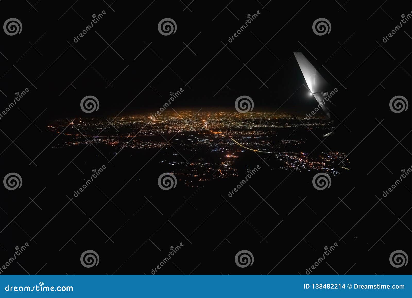 Airplane Wing at Night Over the City Stock Photo - Image of lamp, dark ...