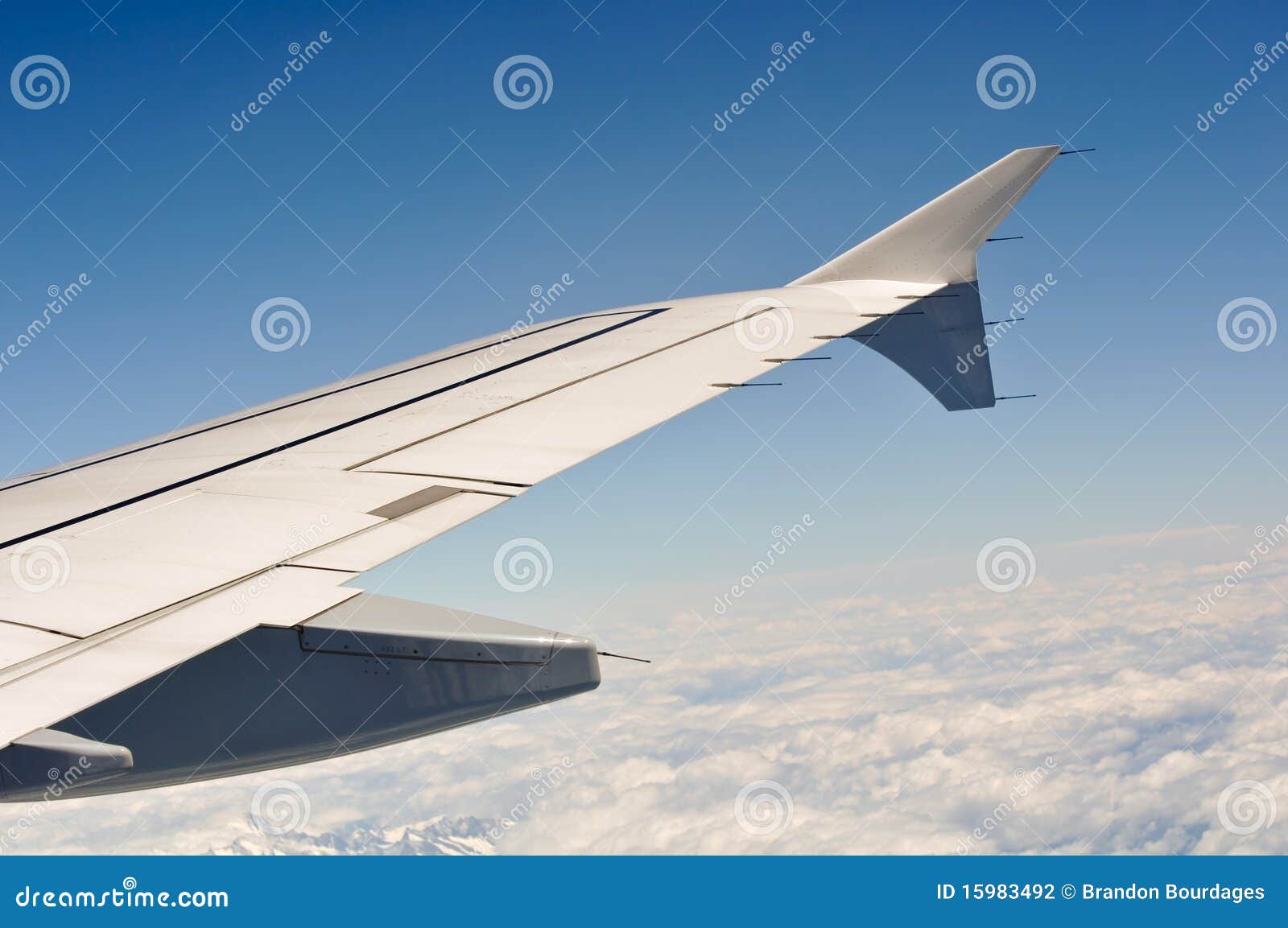 Airplane Wing in the Sky Above Clouds Stock Photo - Image of plane ...