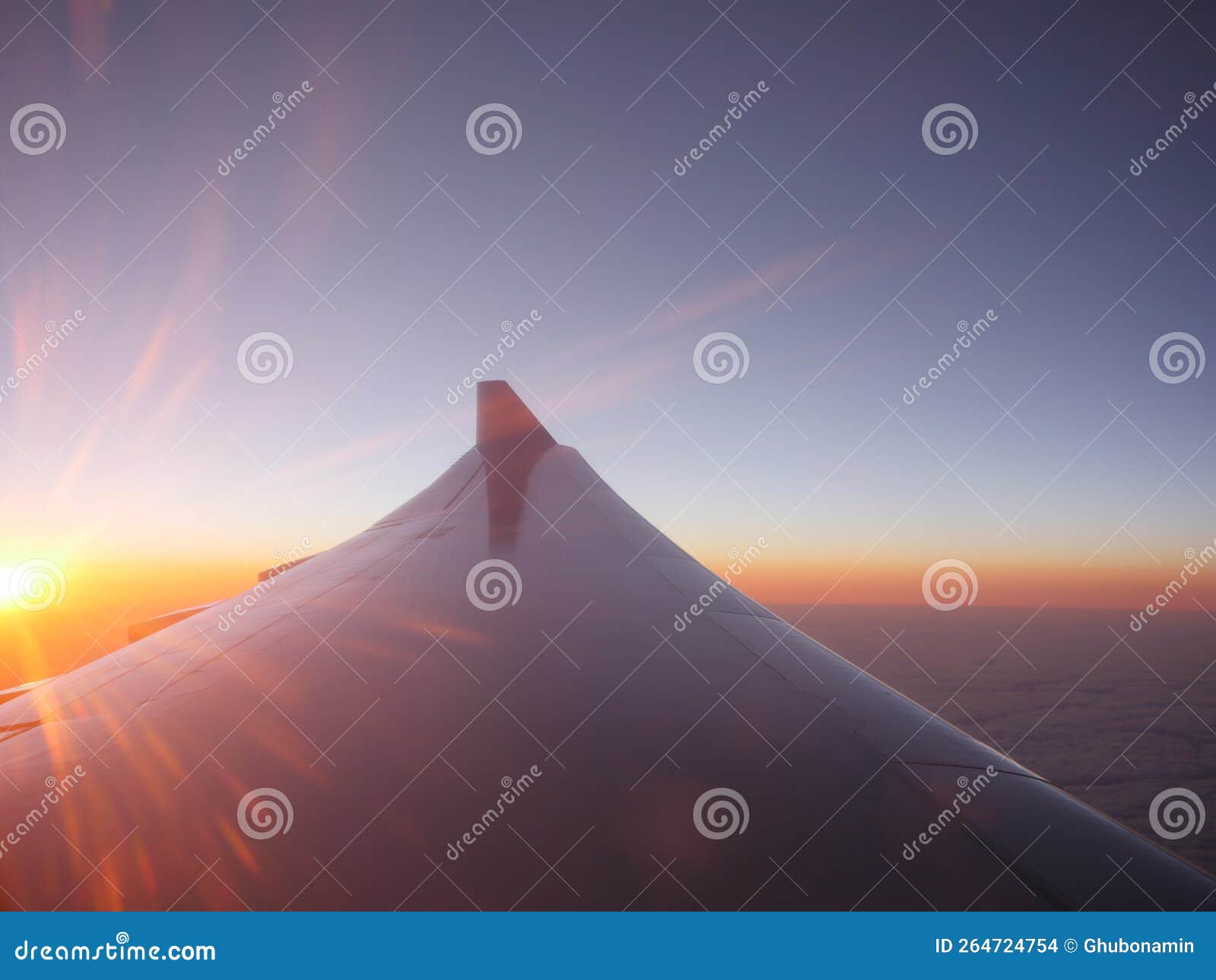 Airplane wing at sunset stock photo. Image of airline - 264724754