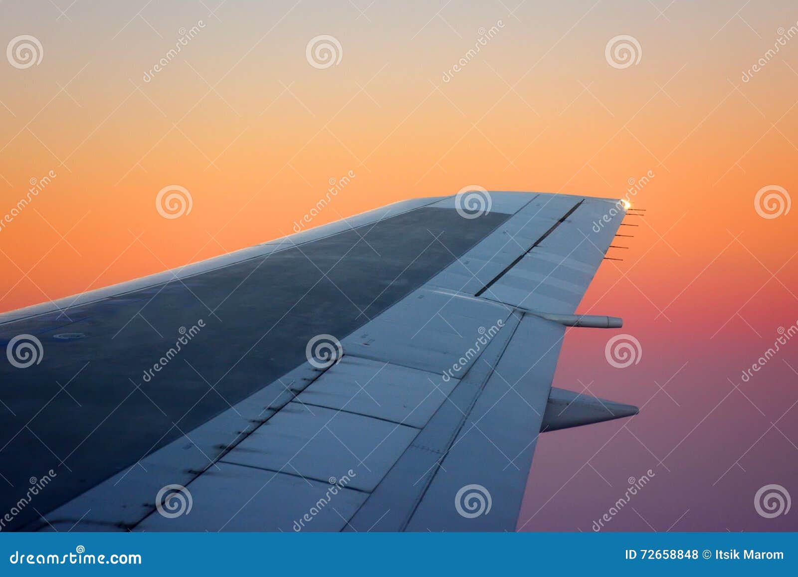 Airplane wing on sunset stock photo. Image of atmosphere - 72658848