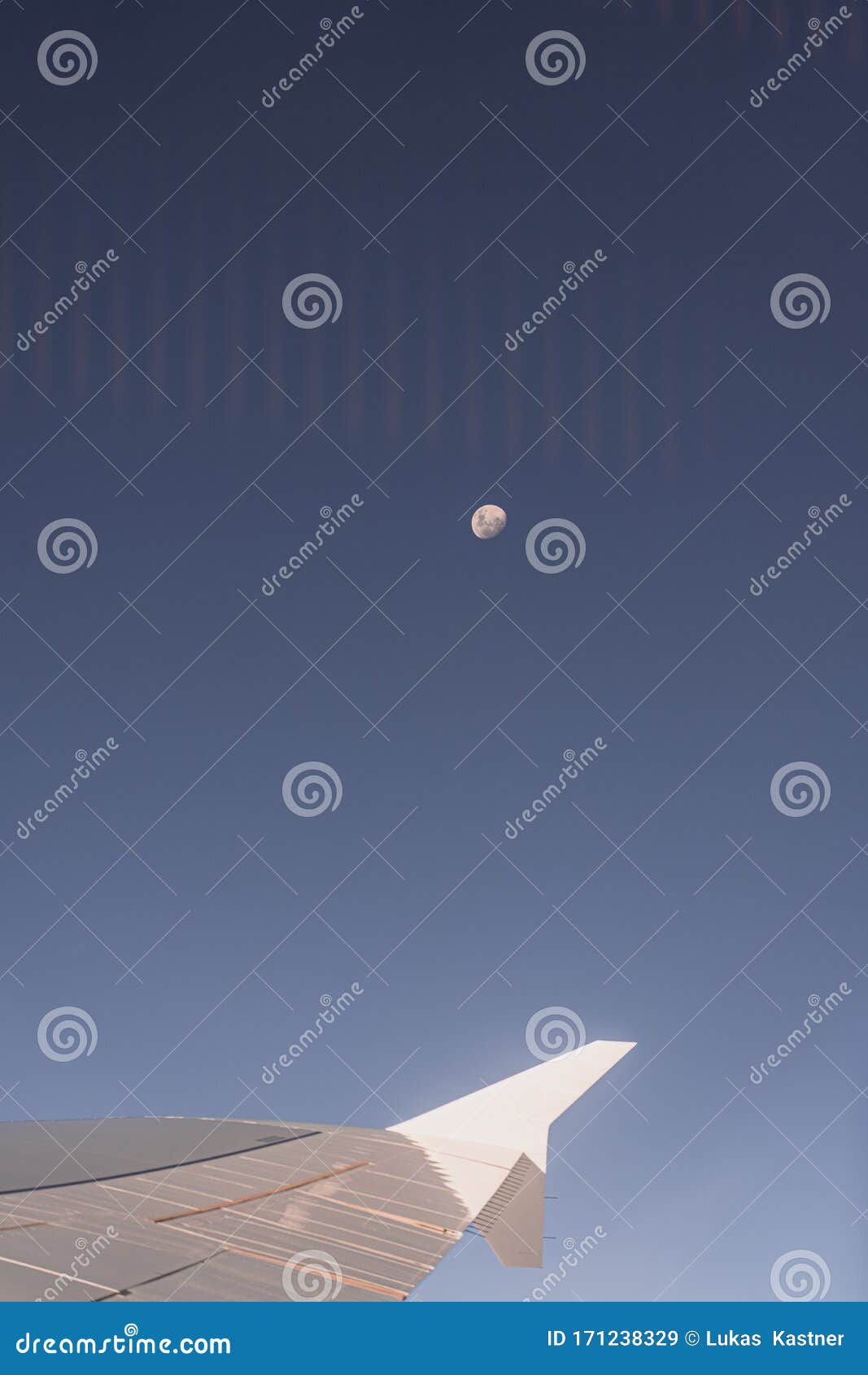 Airplane Wing through the Airplane Window with the Moon in the ...
