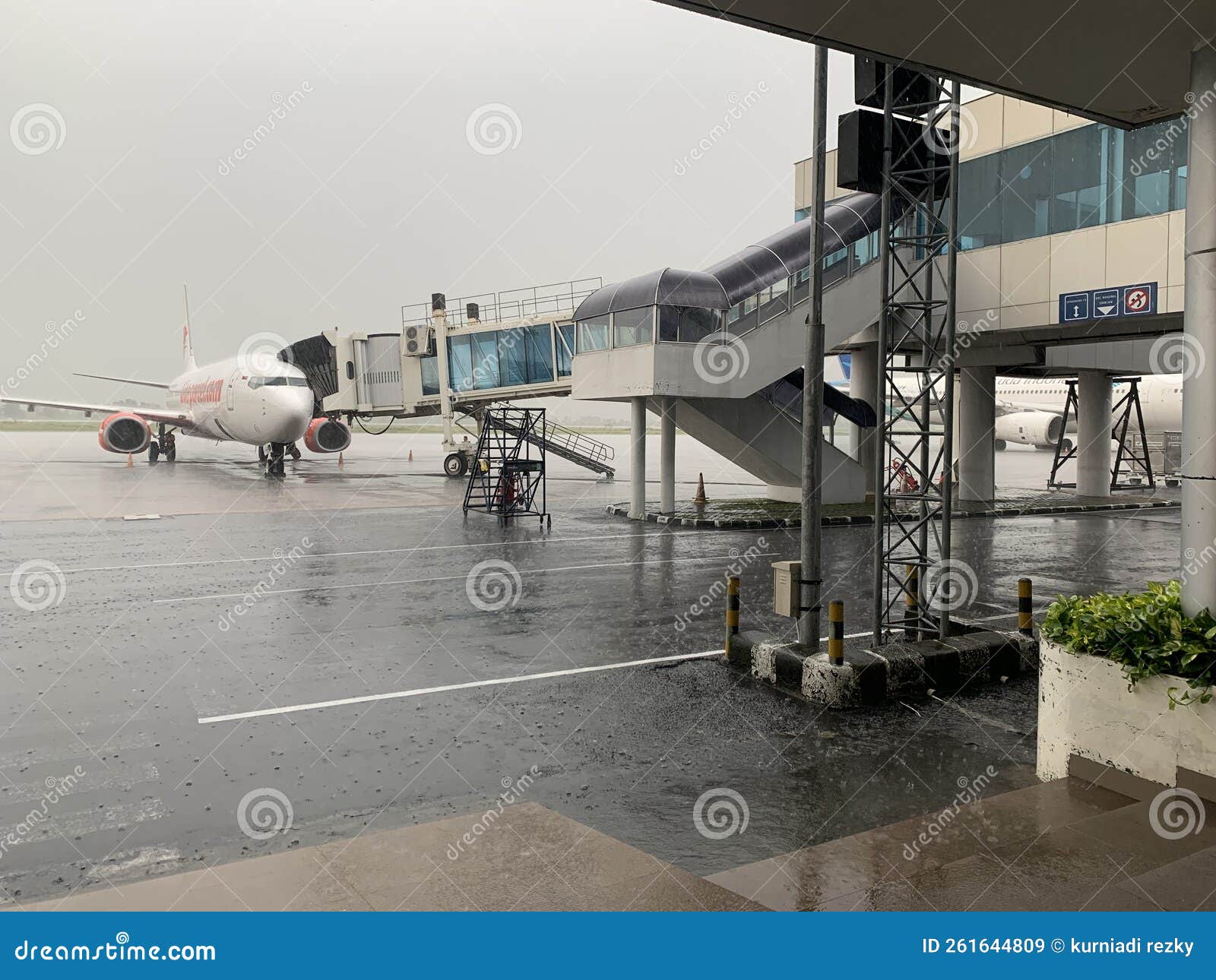 Airport in cloudy editorial stock image. Image of flight - 261644809