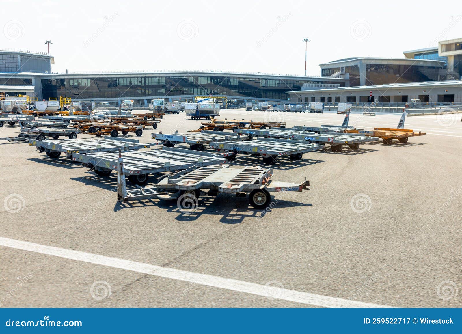 Airport Malpensa in Milan with the Carts and Passenger Planes Preparing ...