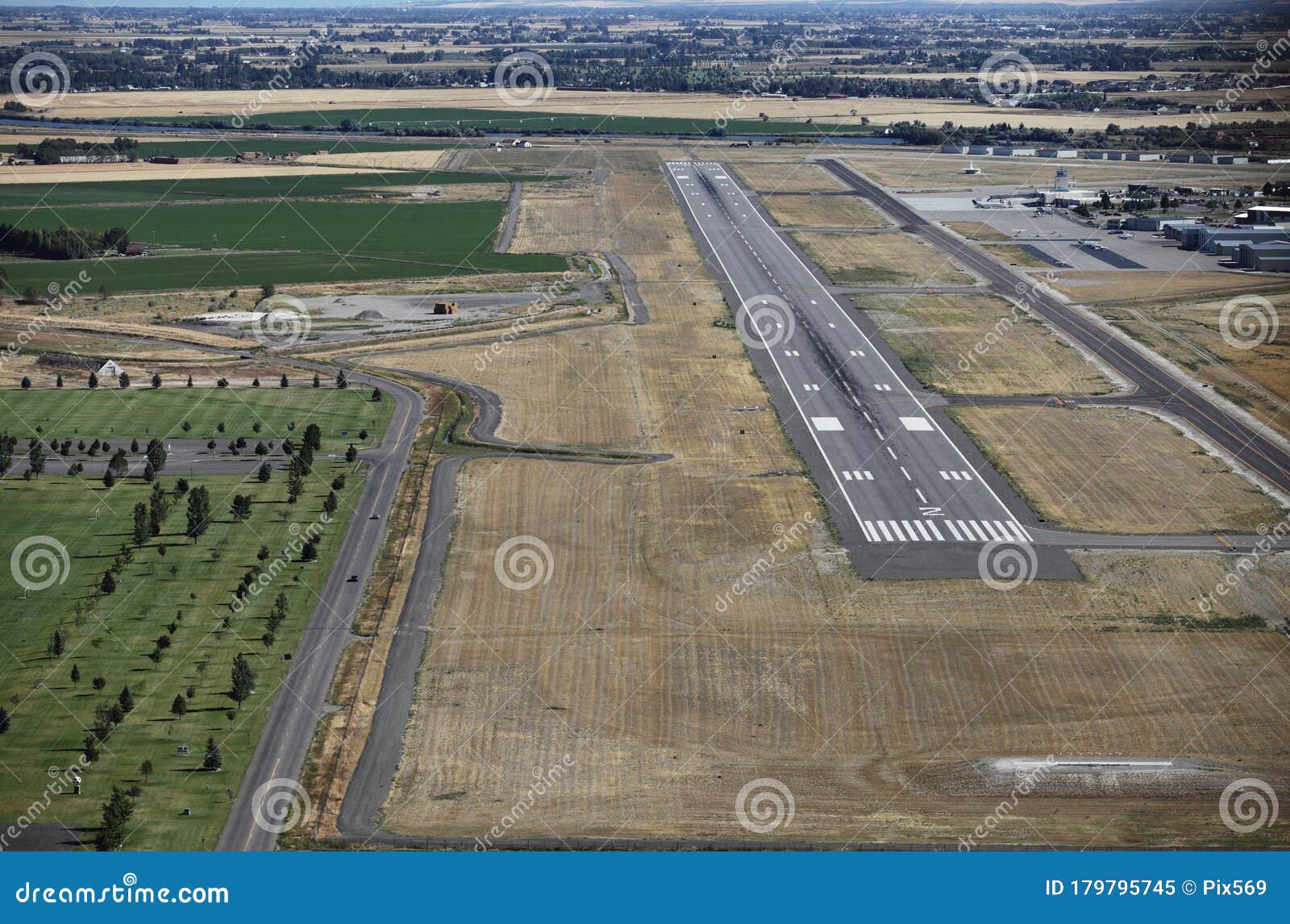 The Runway and Taxiway at a Small City Airport. Stock Image - Image of ...