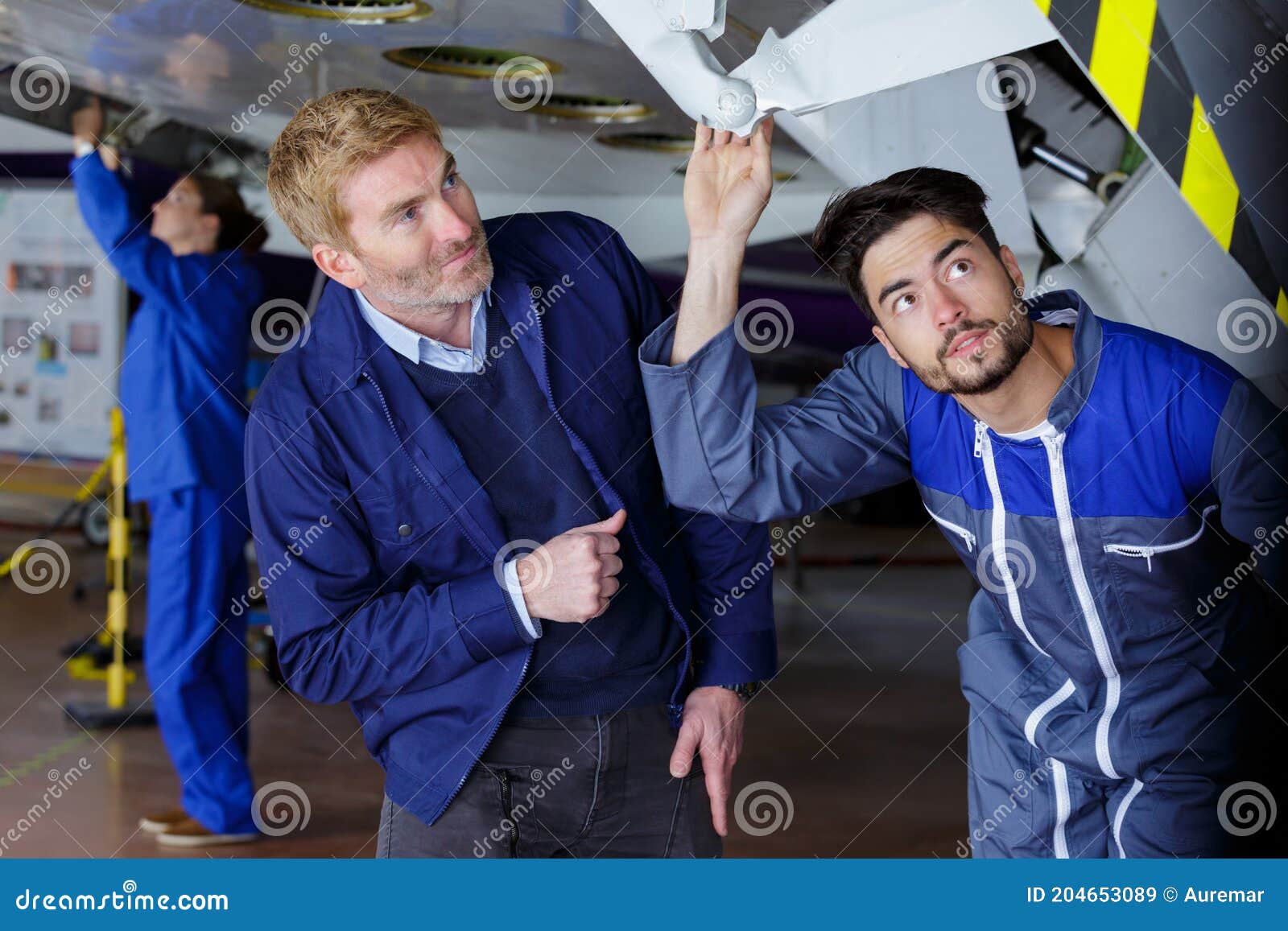 Airport Staff Looking at Aircraft Stock Image - Image of airport ...