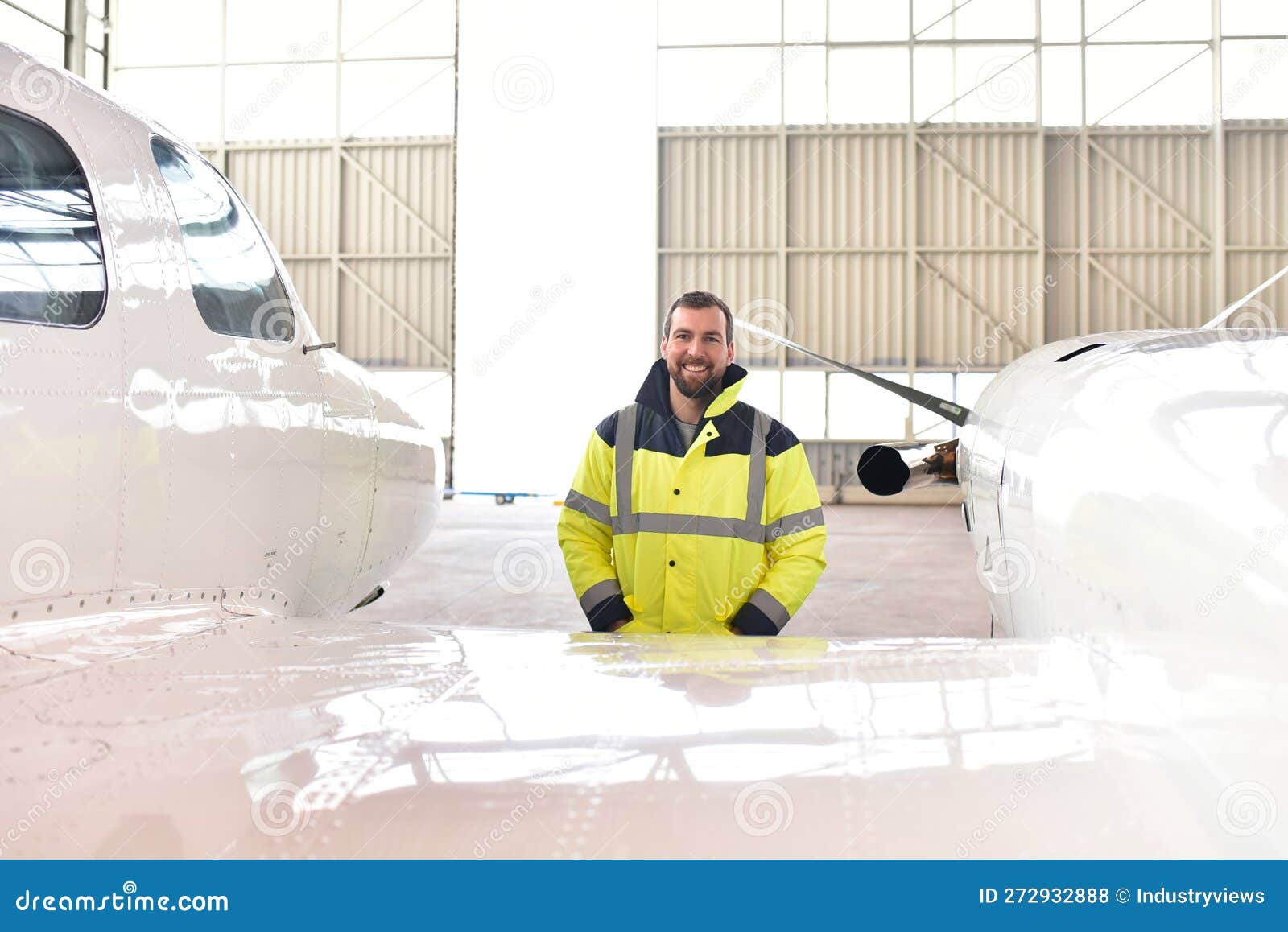Airport Workers Check an Aircraft for Safety in a Hangar Stock Photo ...